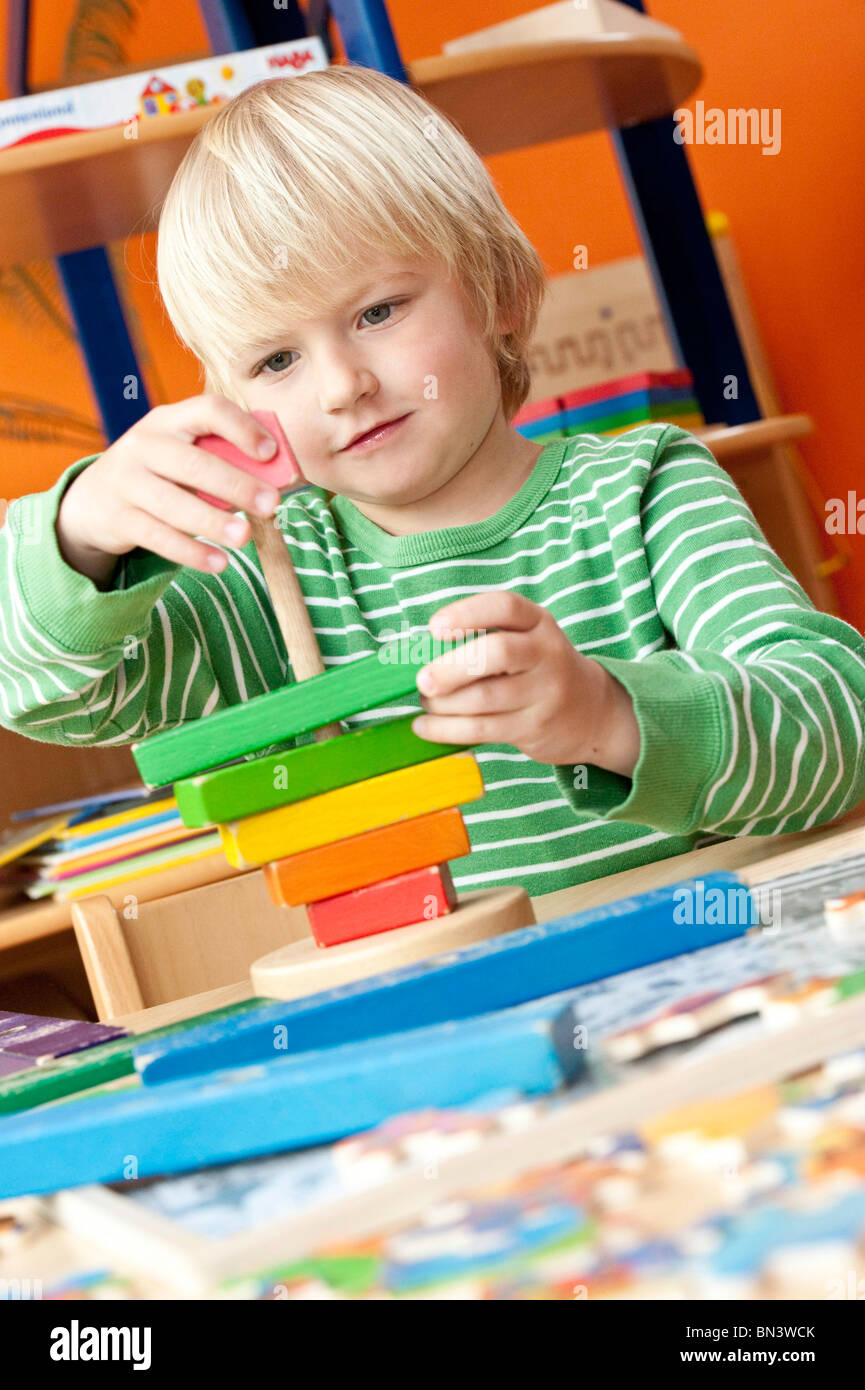 Boy playing blocks coloured hi-res stock photography and images - Alamy