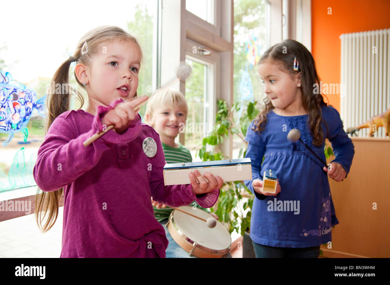 Children making music in a kindergarten Stock Photo - Alamy