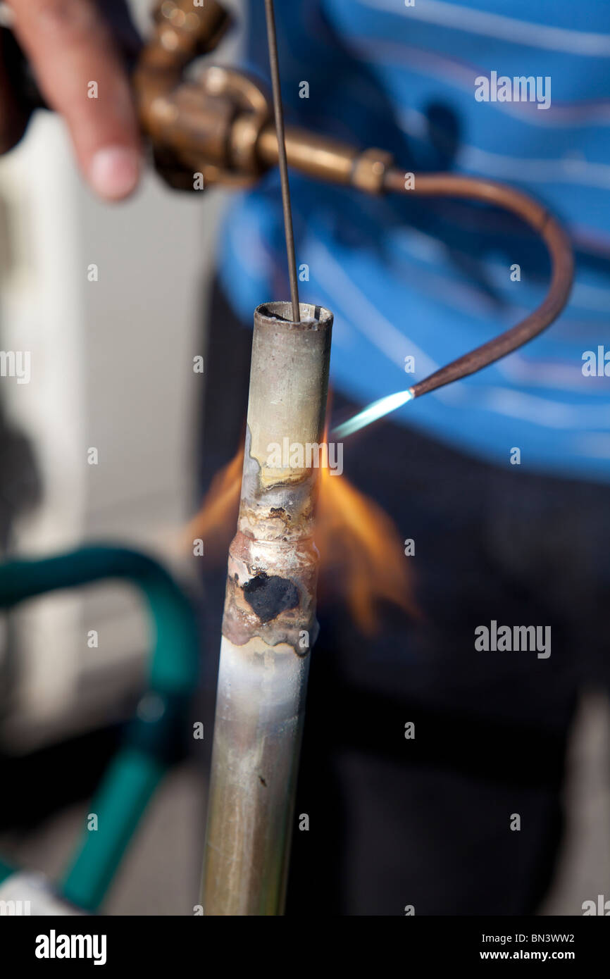 Welding a metal rod Stock Photo - Alamy