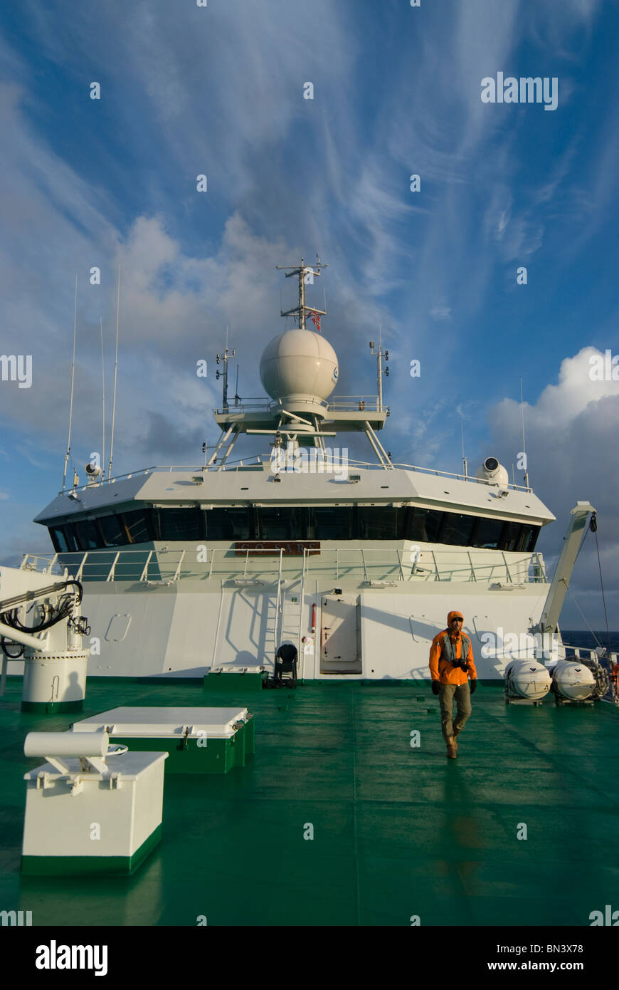 Man standing on deck of the G.O.Sars, a research vessel, Antarctica ...