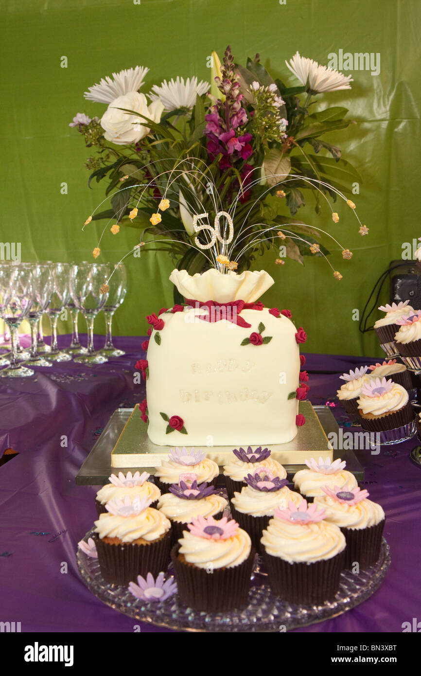 Iced Red Velvet cake decorated with small red roses made of icing Stock ...