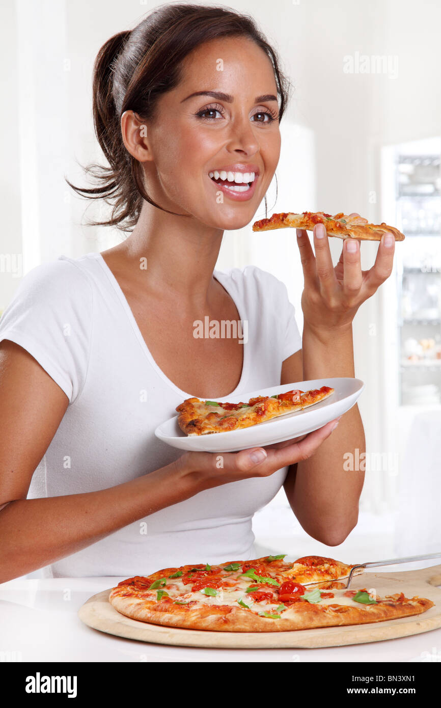 WOMAN EATING PIZZA Stock Photo - Alamy