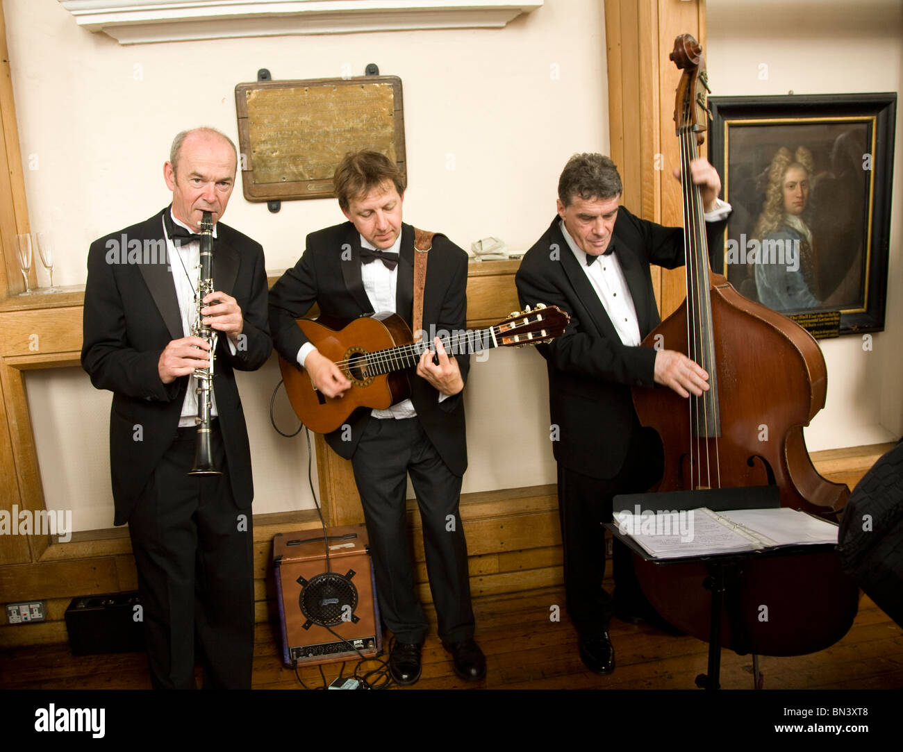 Three men jazz trio playing in black suits bow ties Stock Photo - Alamy