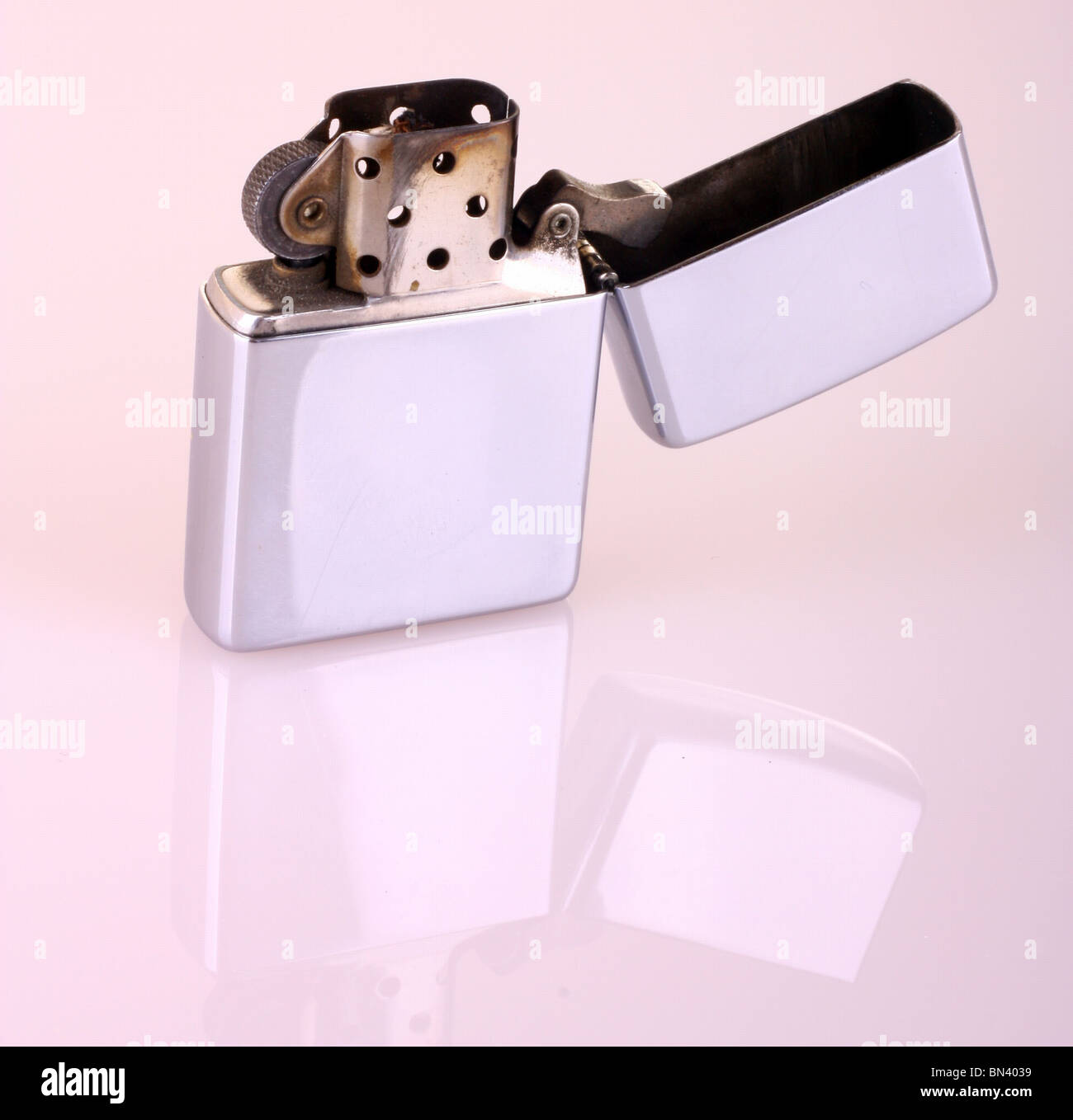 Classic steel lighter shot on white background Stock Photo - Alamy