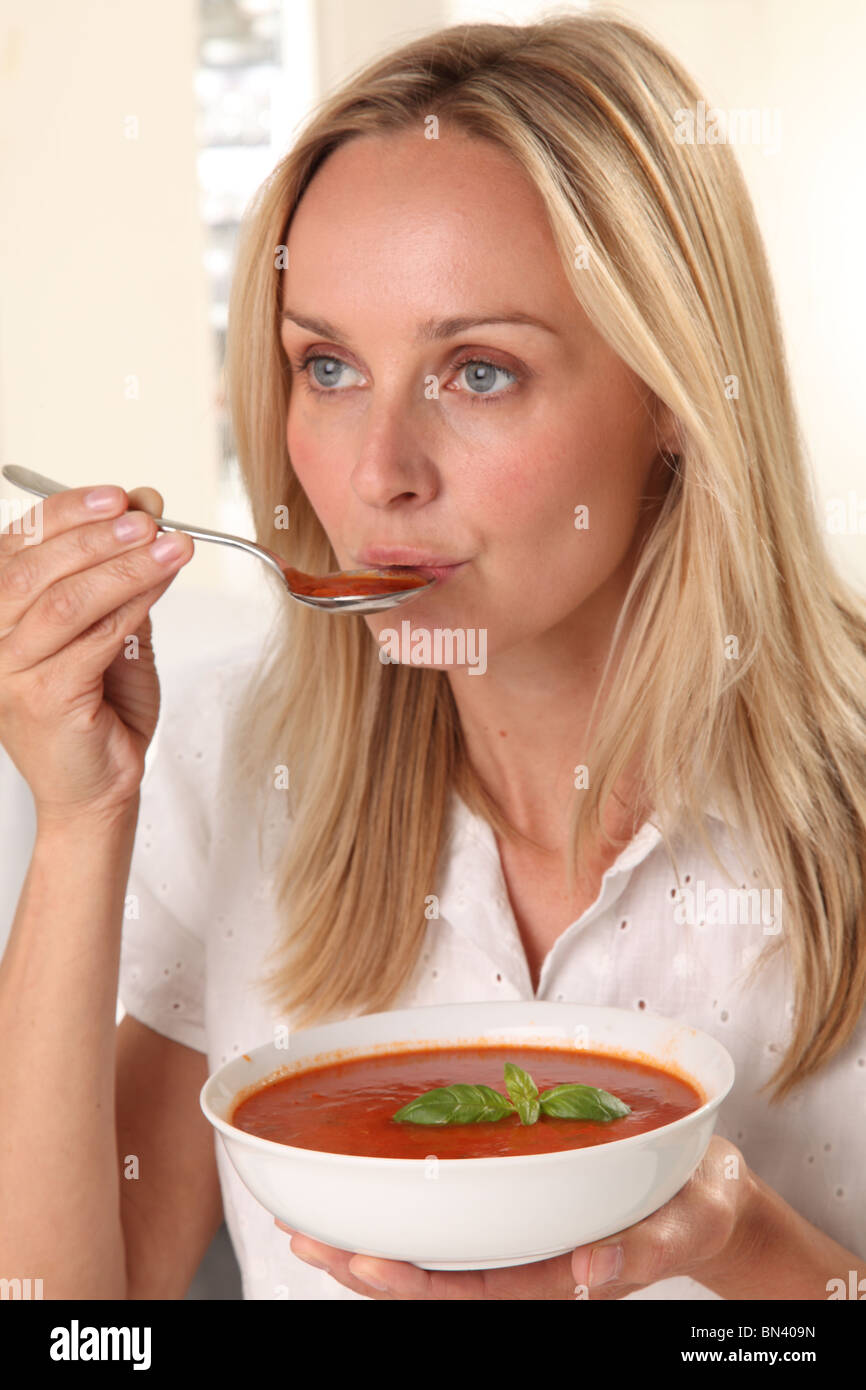 WOMAN EATING SOUP Stock Photo - Alamy