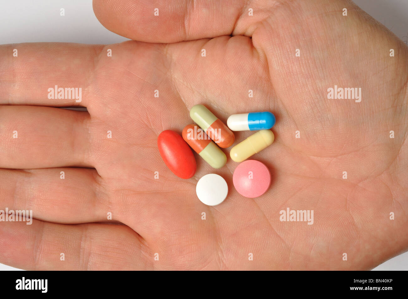 Hand with Pills Stock Photo - Alamy