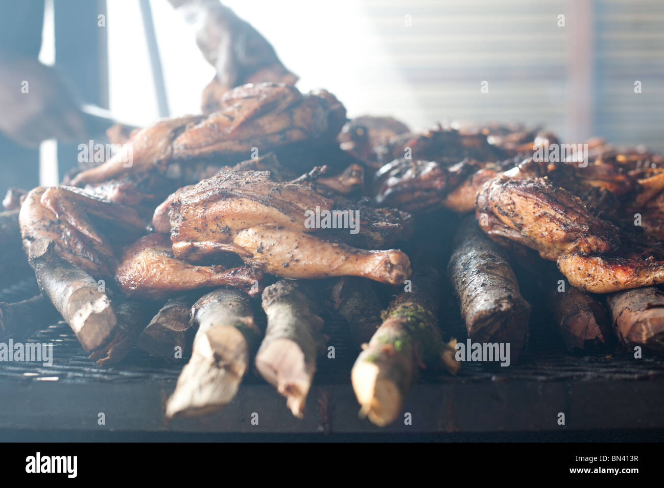 Authentic jerk chicken made over a fire on logs. Made at Scotchies Too ...