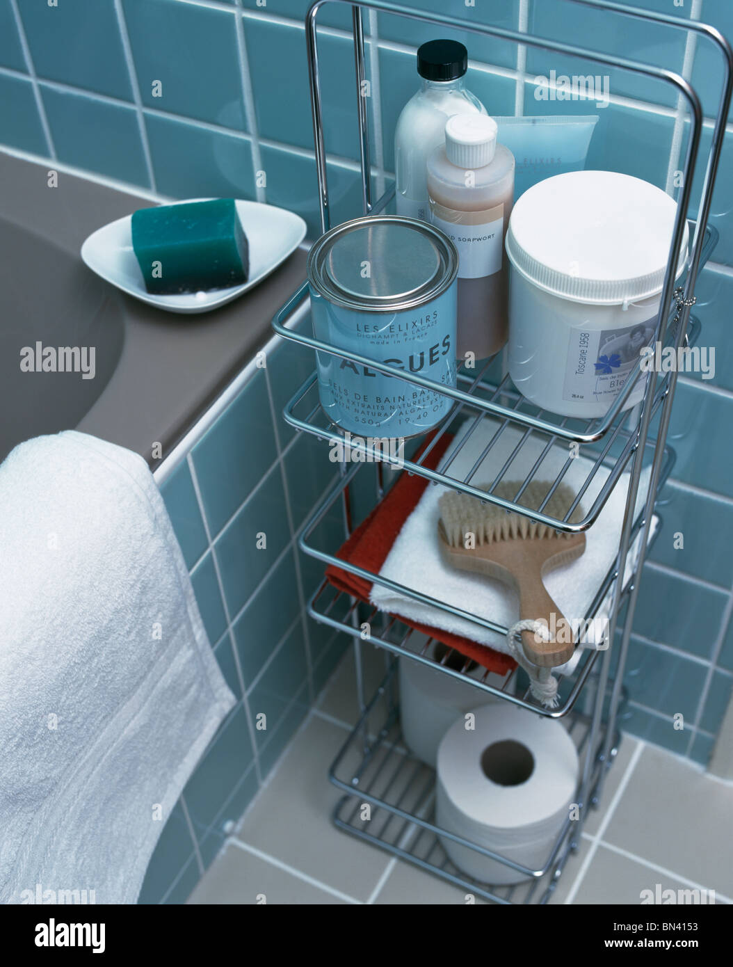 Close-up of bottles and pots of bathroom toiletries on modern stainless ...