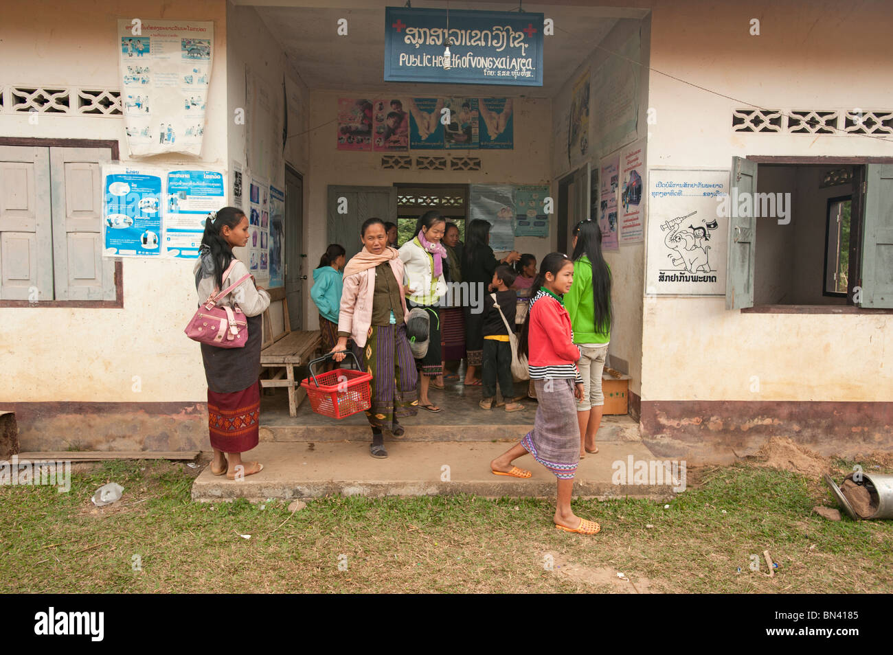 Lao women leave a public health clinic Muang Ngoi village Northern Laos ...
