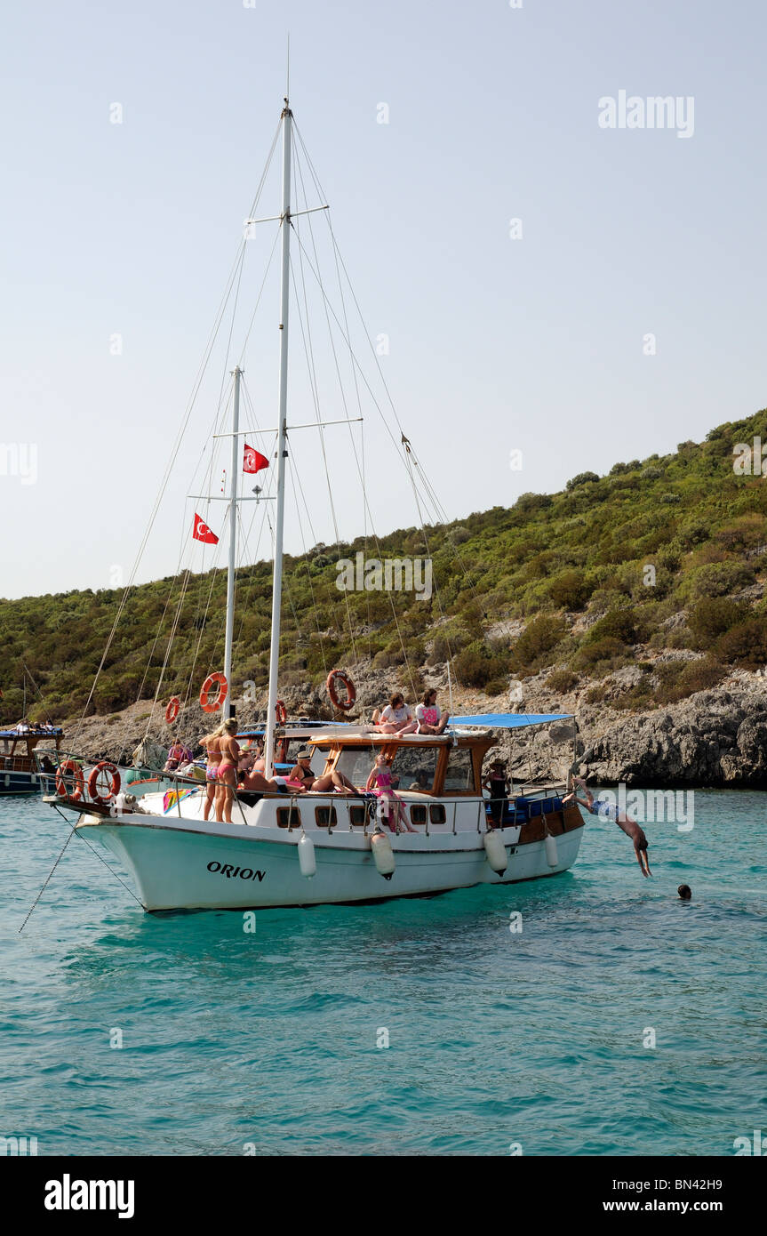 Holidaymakers sunbathing on a traditional Gulet boat off the Turkish ...