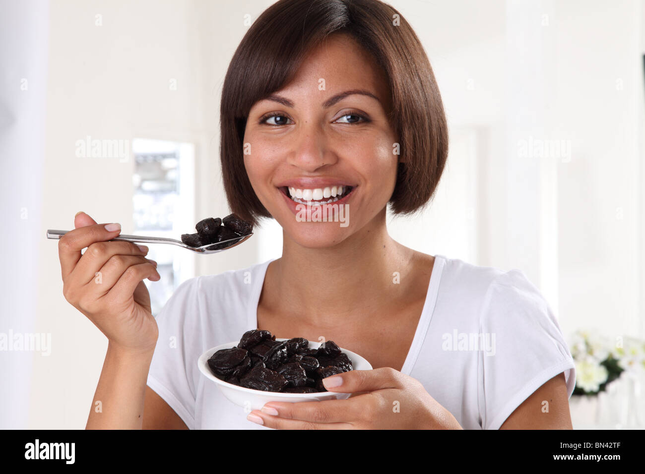 WOMAN EATING PRUNES Stock Photo - Alamy
