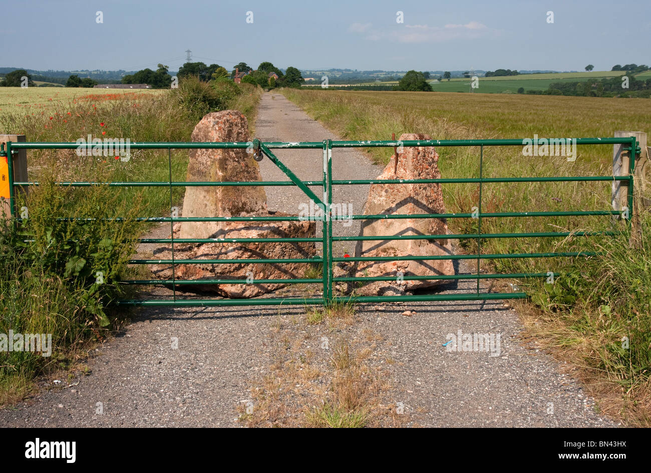Gate blocked off on a farm track using concrete blocks Stock Photo - Alamy