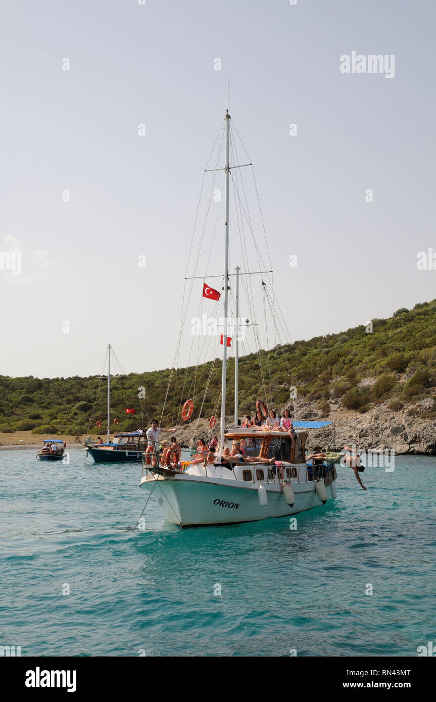 Holidaymakers sunbathing on a traditional Gulet boat off the Turkish ...