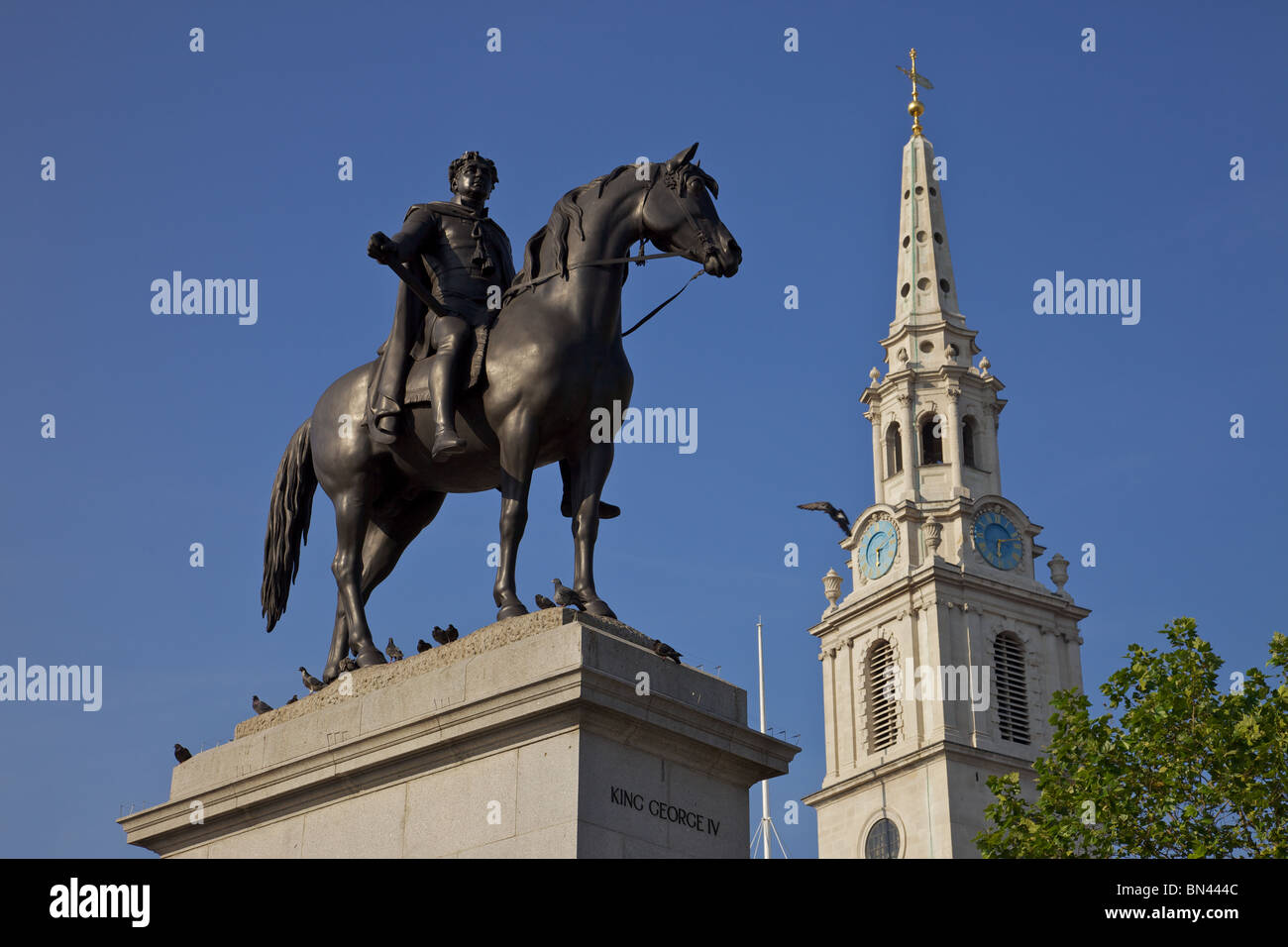 Statue of King George 1V in Trafalgar Square London, with St Martins in ...
