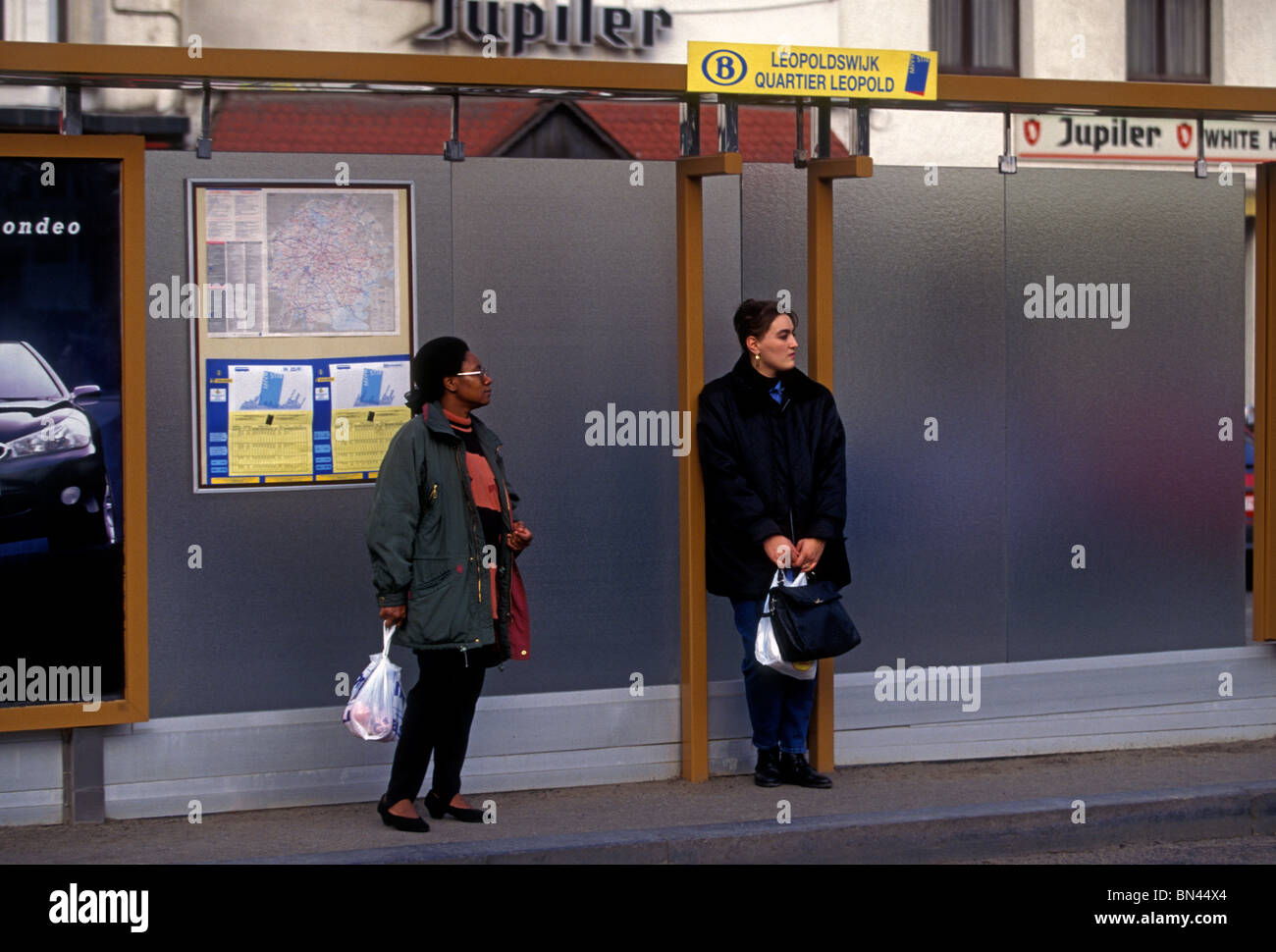 People two women at bus stop city of Brussels Brussels Capital Region ...