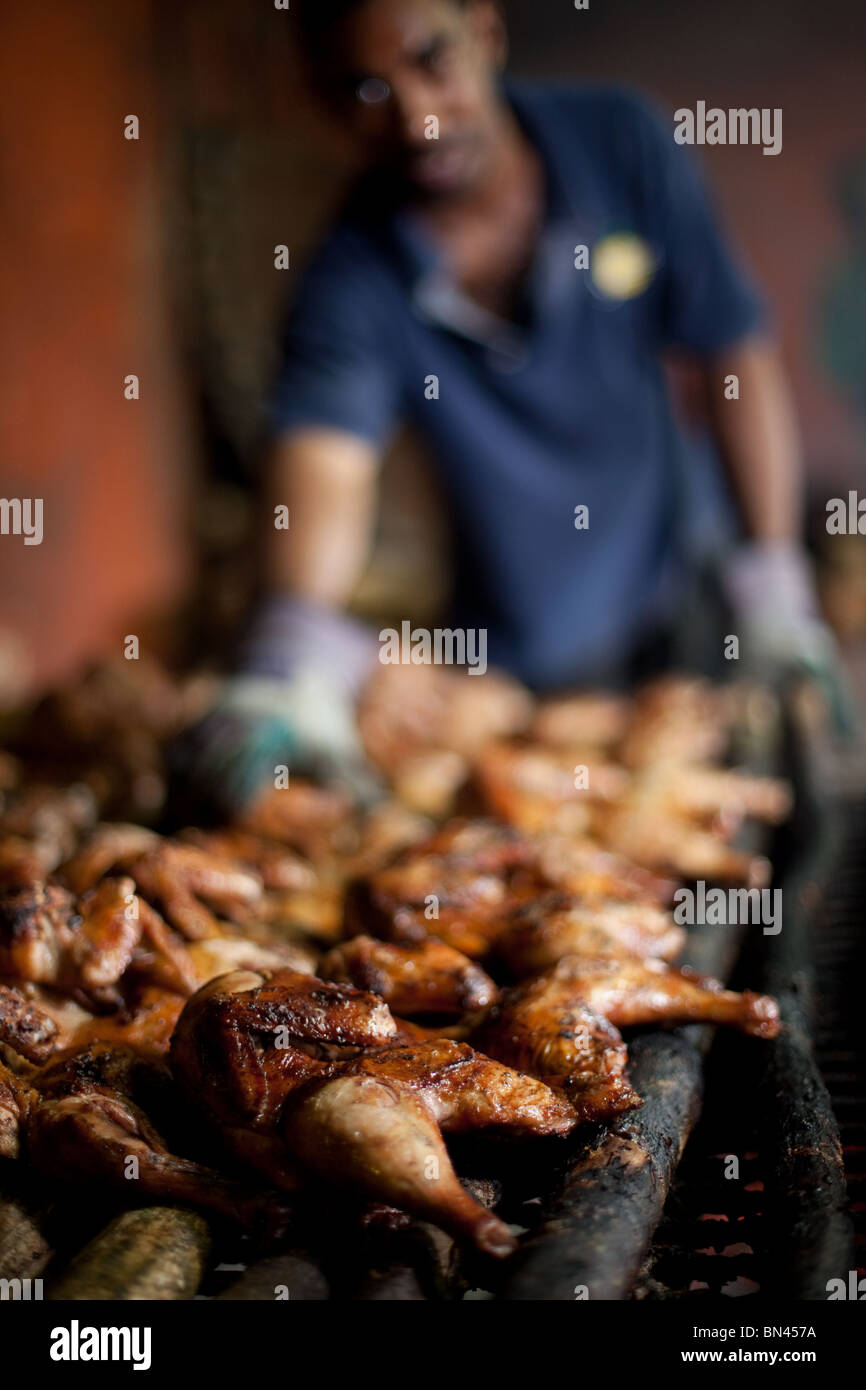 Authentic jerk chicken made over a fire on logs. Made at Scotchies Too ...