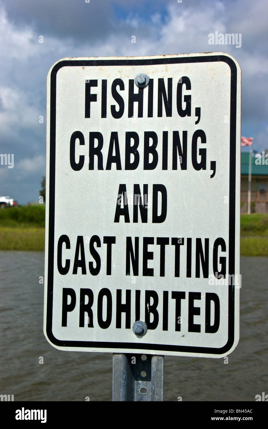 Sign prohibiting fishing crabbing net casting from bridge in Cameron ...
