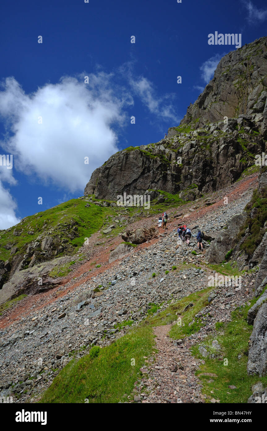 A party of walkers traverses Great Hell Gate under Tophet Wall on Great ...