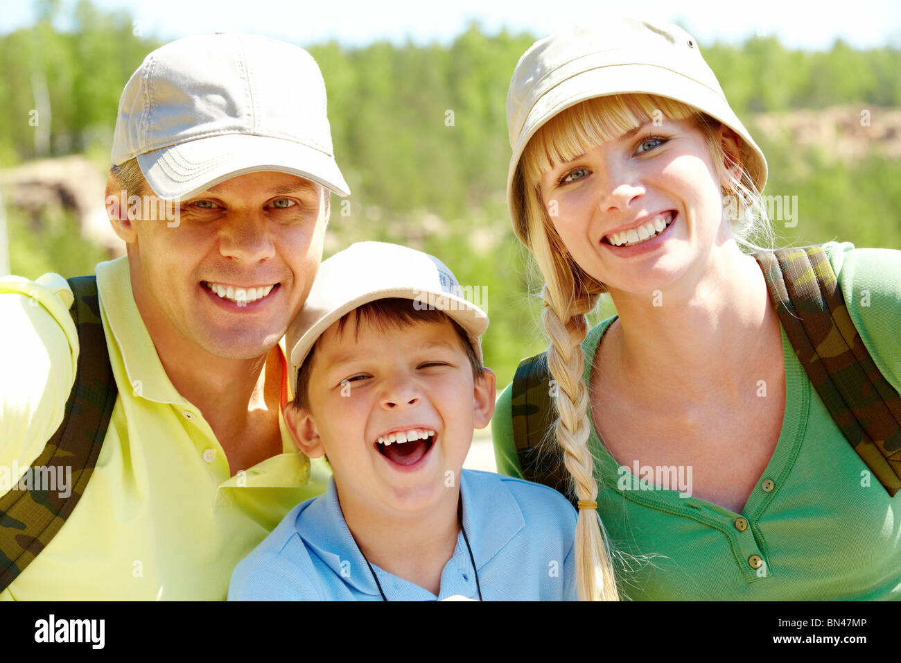 Portrait of happy family looking at camera Stock Photo - Alamy
