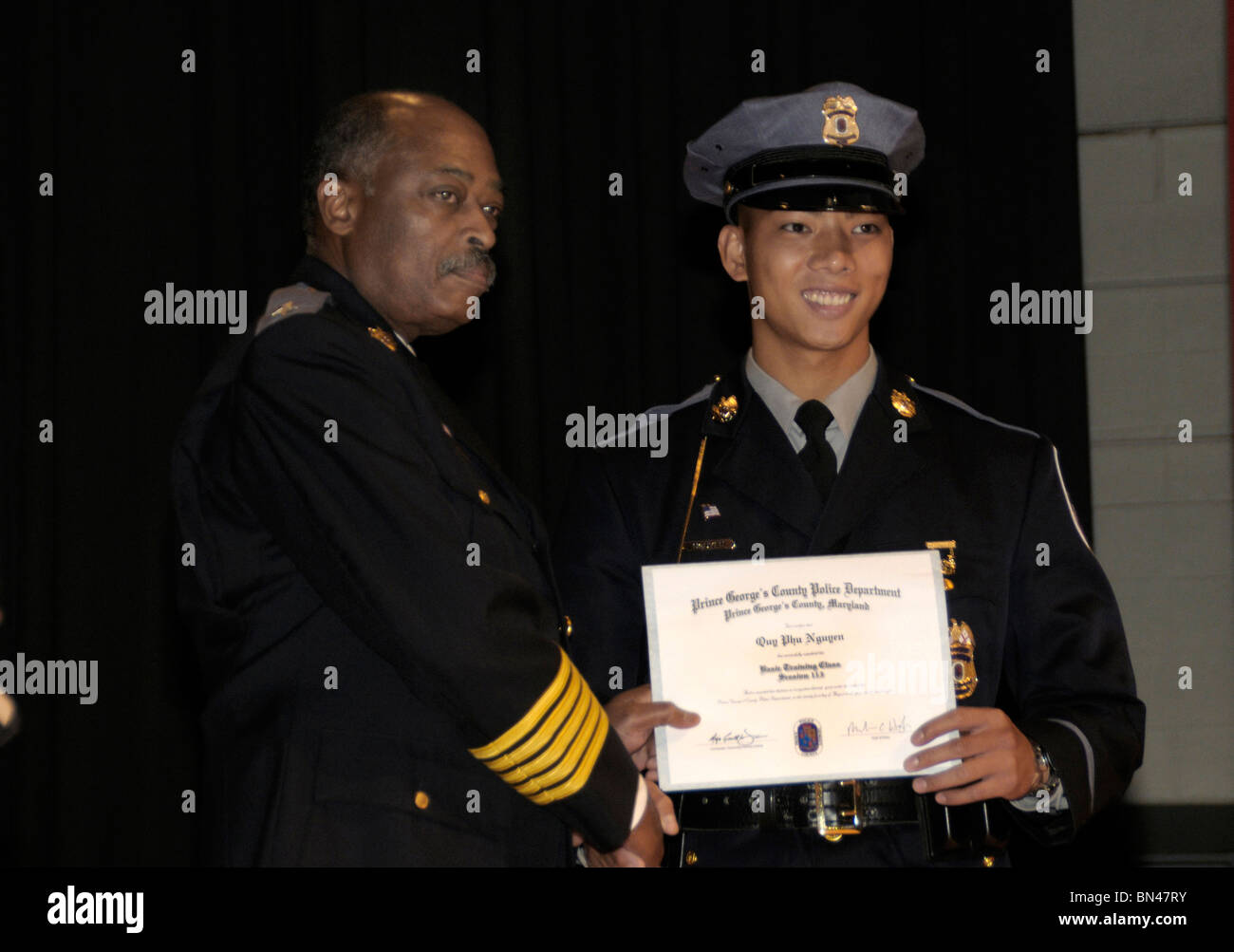 A Vietnamese Prince George's County policeman receives an award from ...