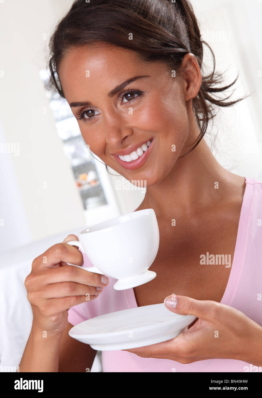 WOMAN DRINKING TEA Stock Photo - Alamy