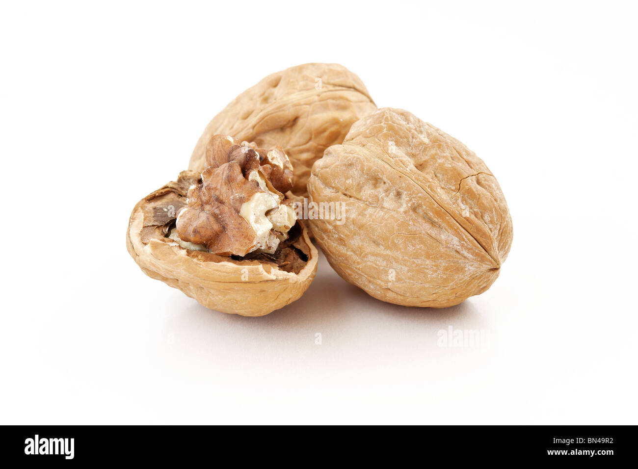 three walnuts isolated on white background Stock Photo - Alamy