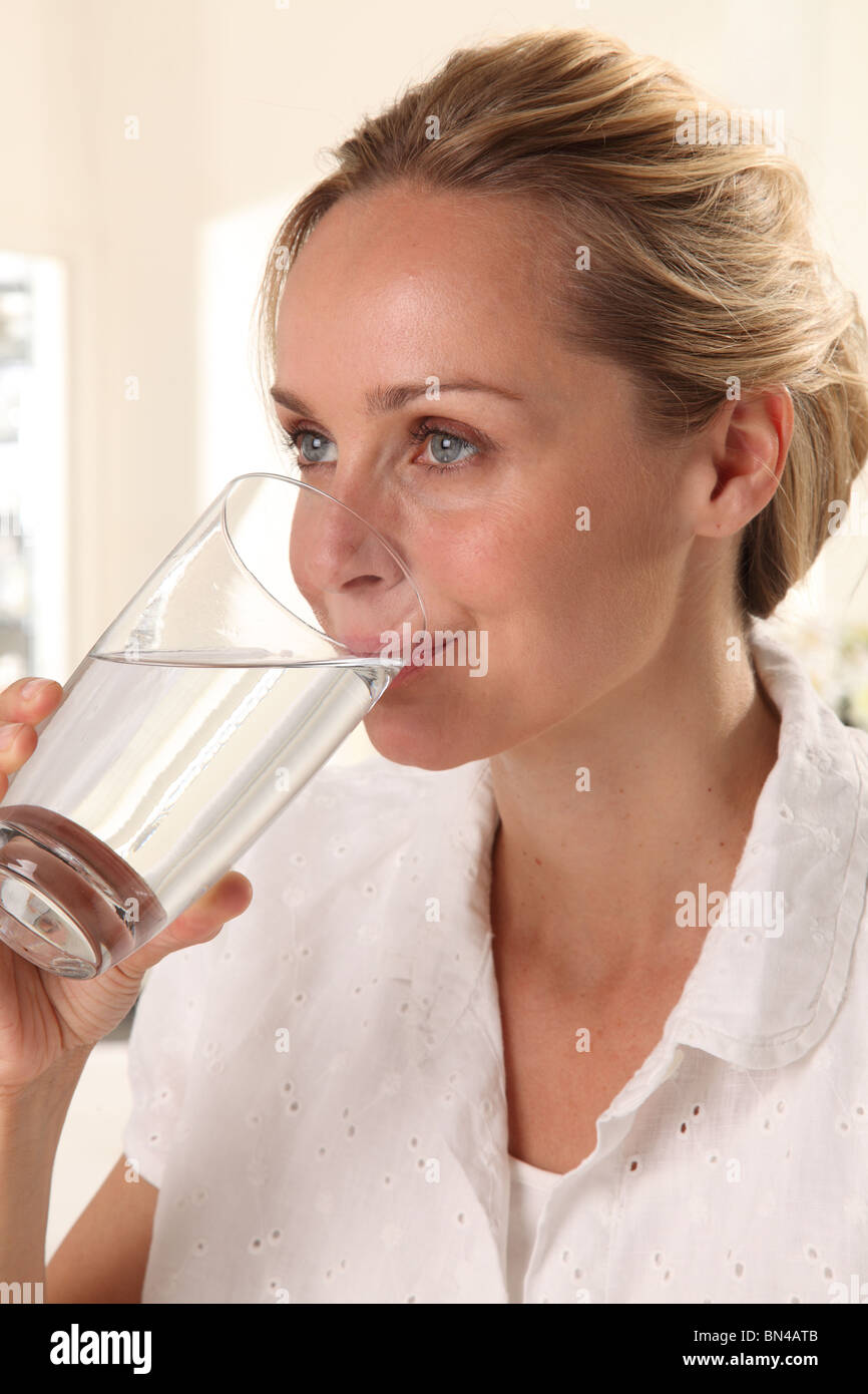 WOMAN DRINKING WATER Stock Photo - Alamy