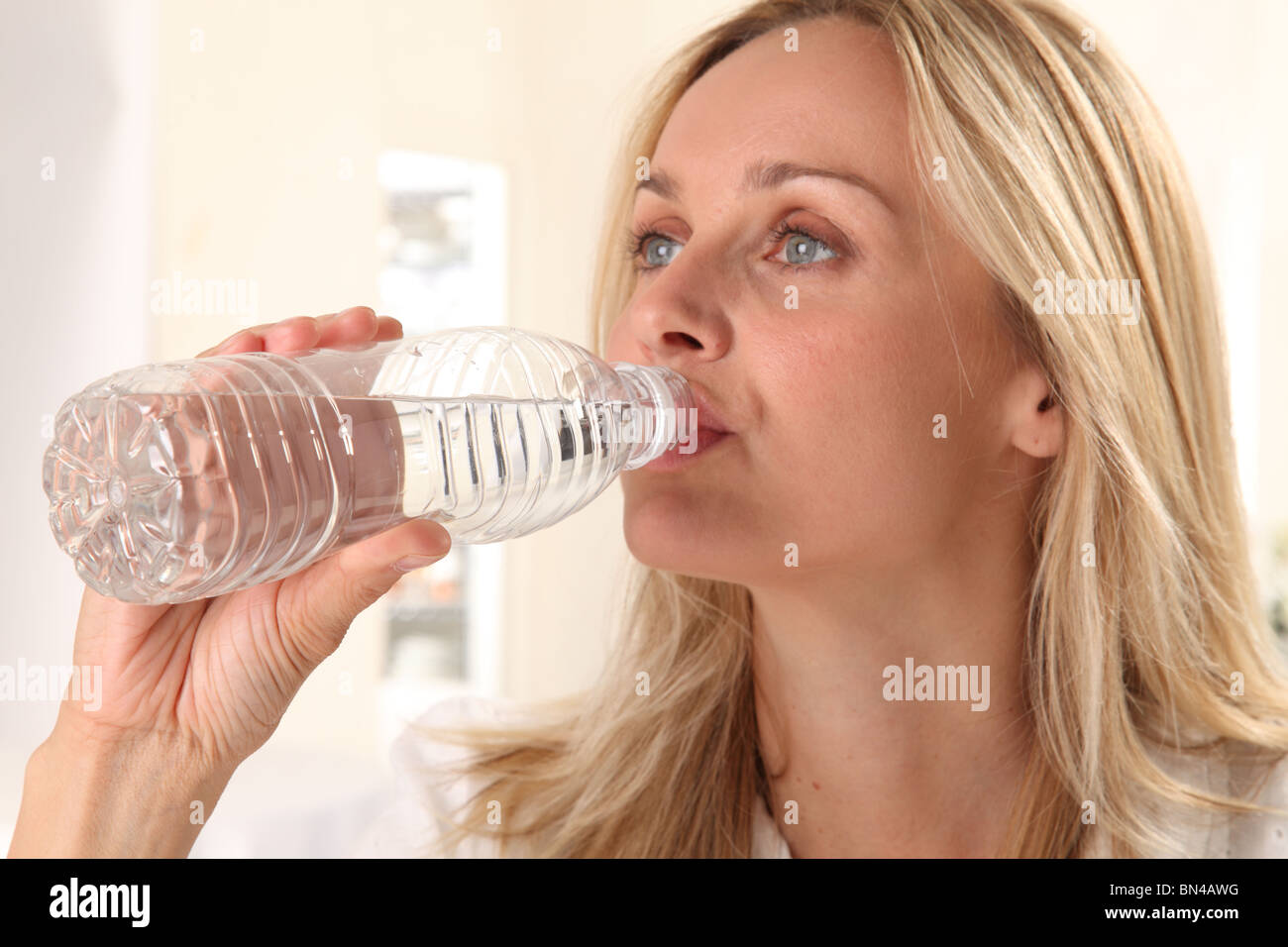 WOMAN DRINKING WATER Stock Photo - Alamy