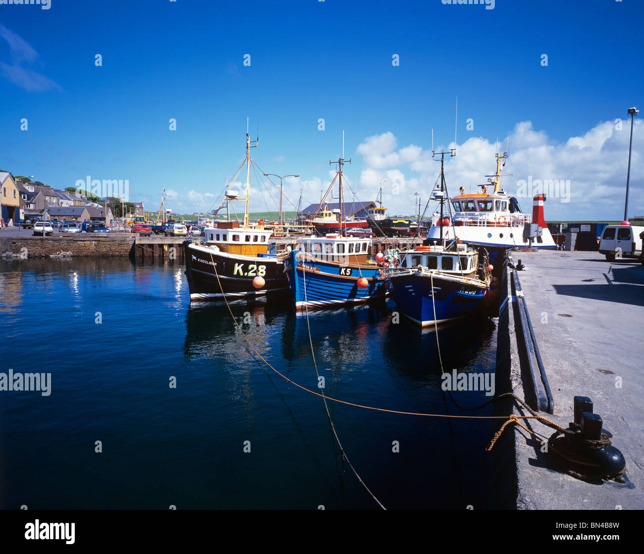 Quayside view of the fishing harbour and port of Stromness on the ...