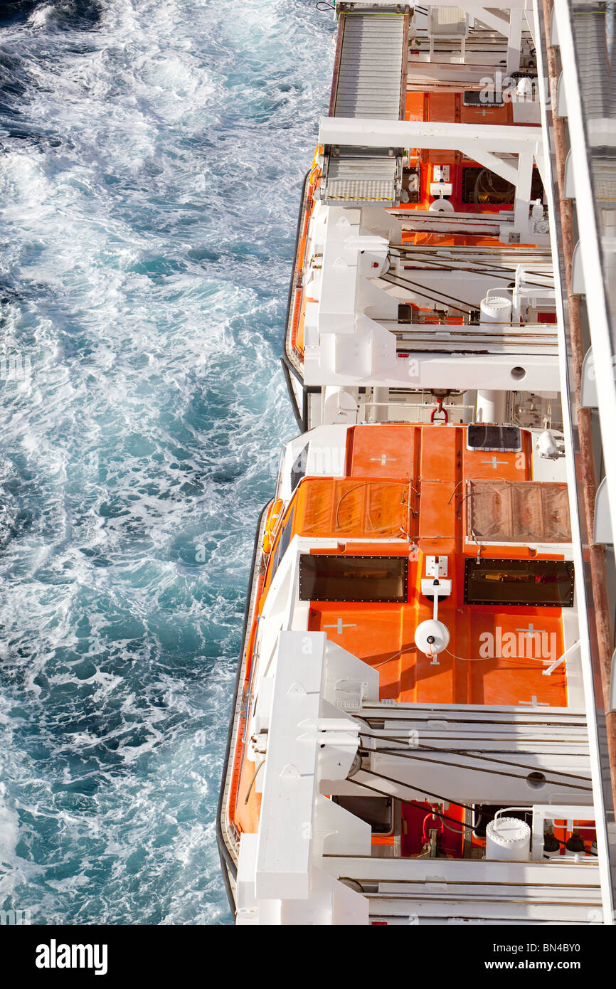 Latest lifeboat designs sitting secured beneath passenger balconied ...