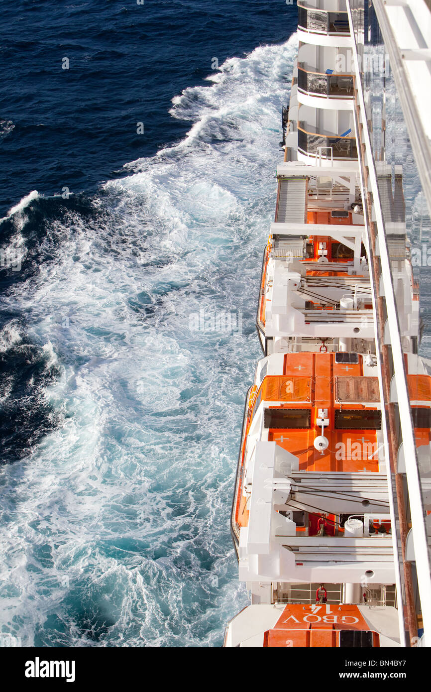 Latest lifeboat designs sitting secured beneath passenger balconied ...