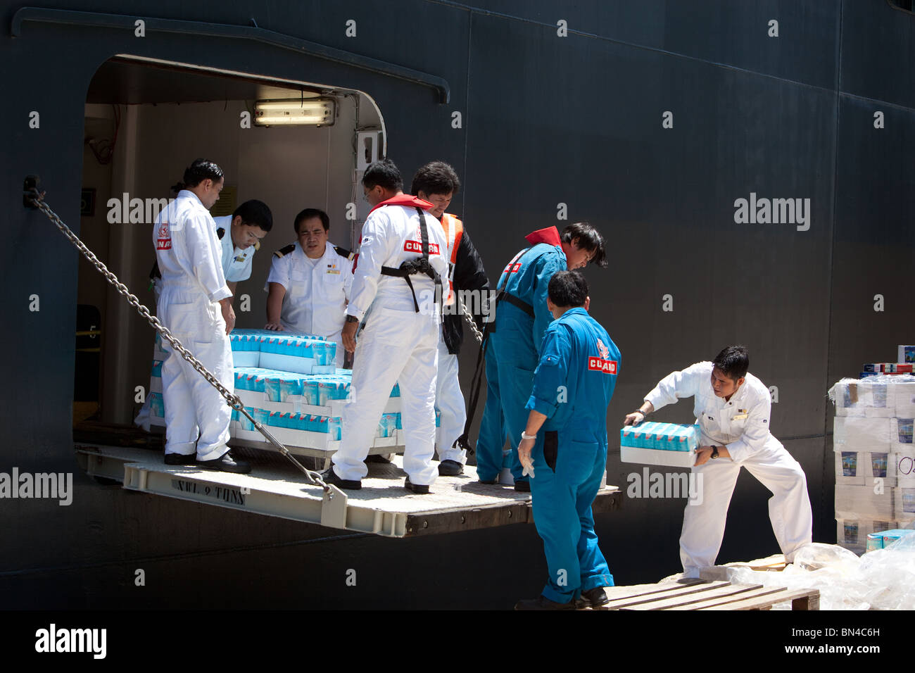 ship's crew loading replenishment stores at Gibraltar Harbour, aboard ...