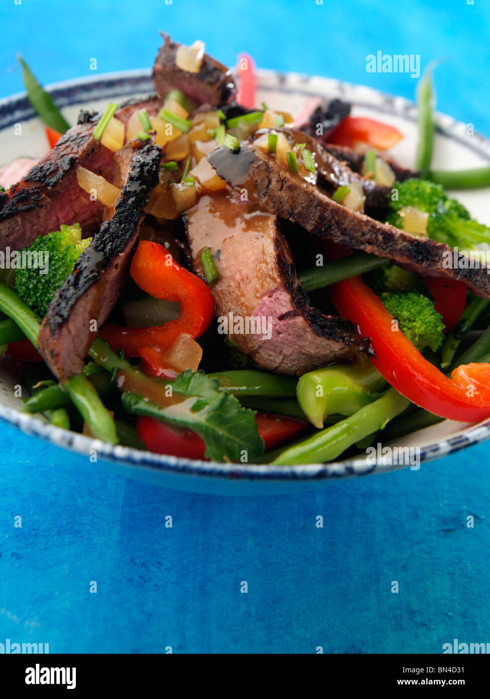 Chargrilled fillet steak strips with vegetable salad honey ginger ...