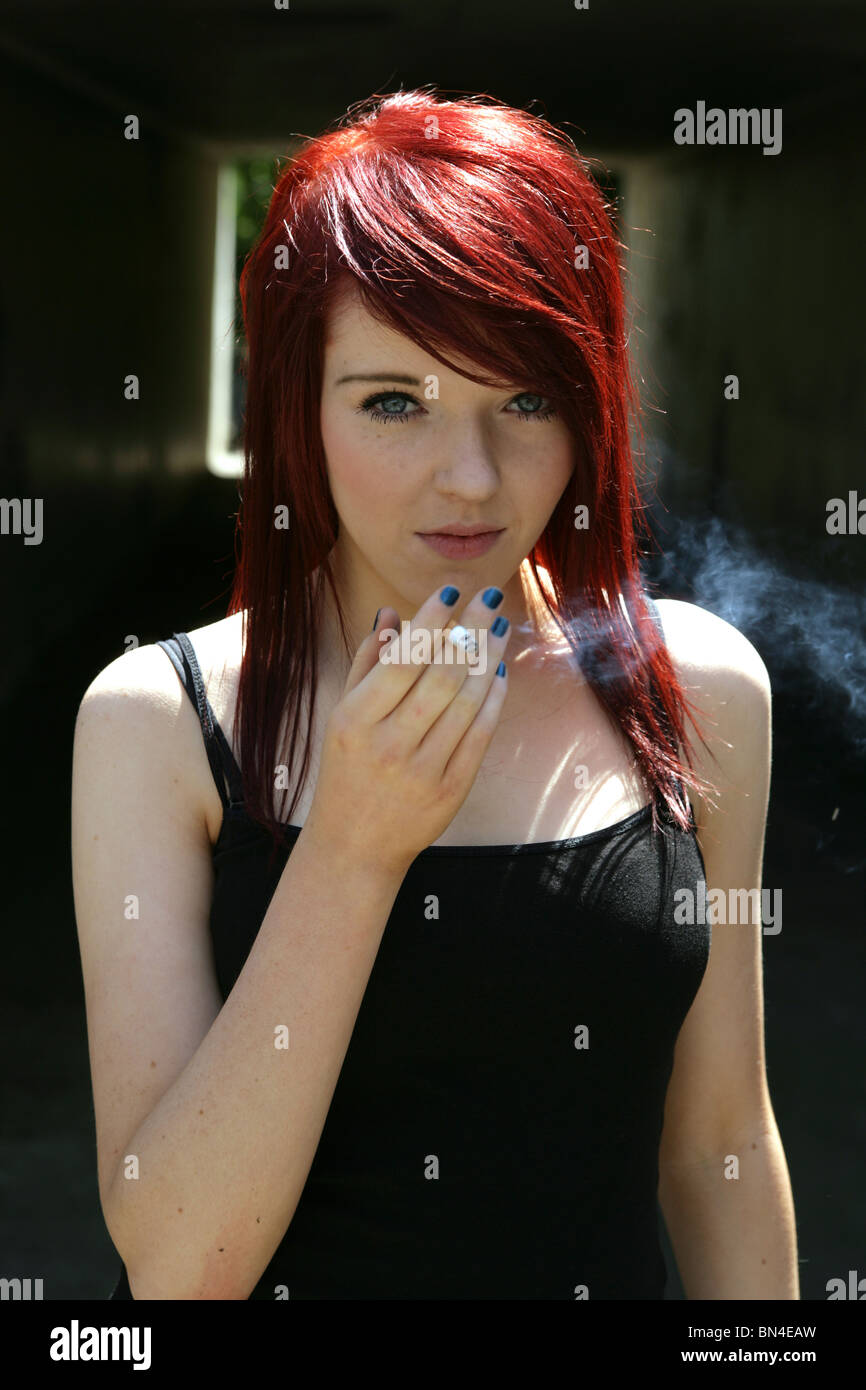 Red haired teenager smoking outside Stock Photo - Alamy