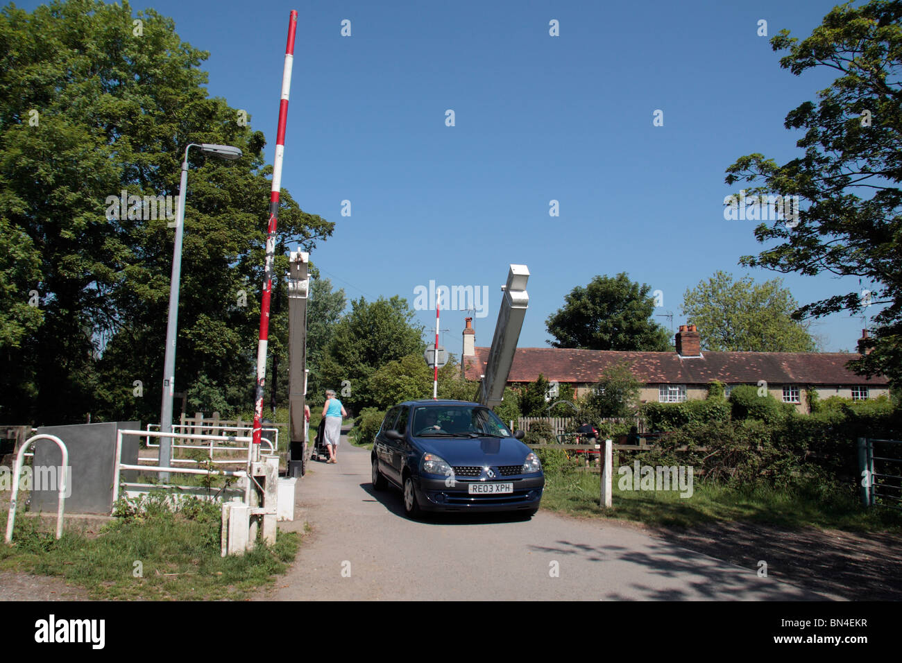 Car crossing the lift bridge over the Basingstoke Canal near the ruins ...