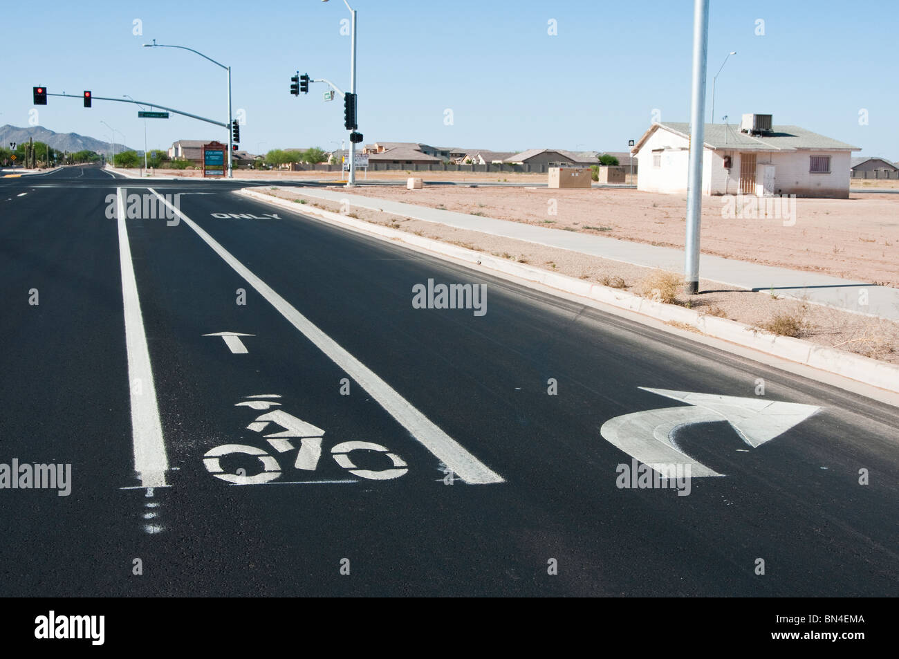 A bike lane is indicated by painted markings on a city street. A right ...