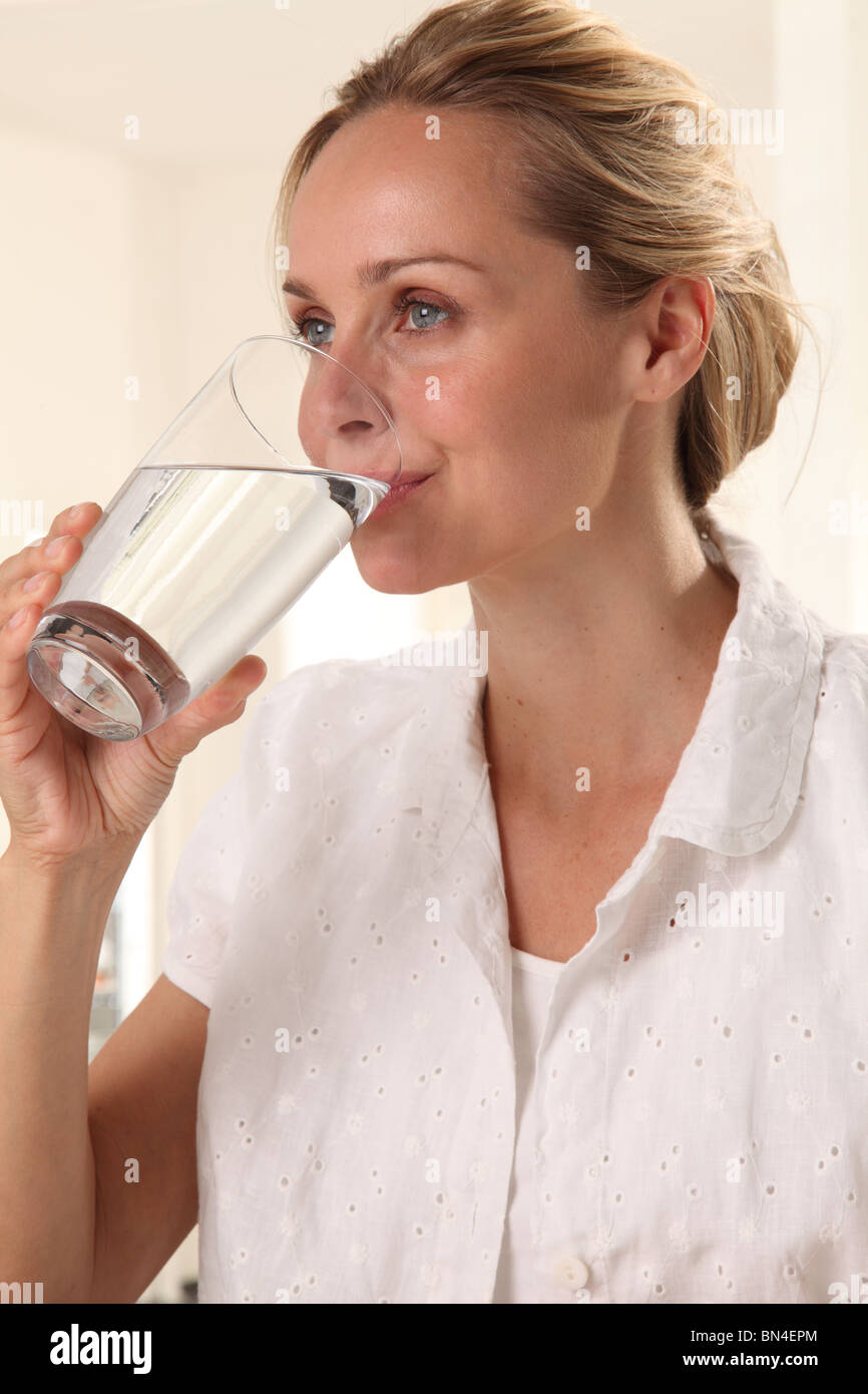 WOMAN DRINKING WATER Stock Photo - Alamy