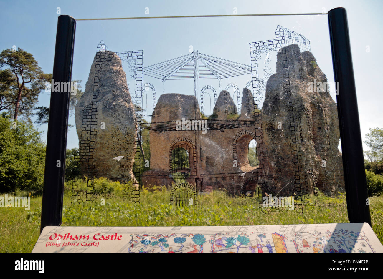 View of flint ruins & octagonal Keep of Odiham Castle through a glass ...