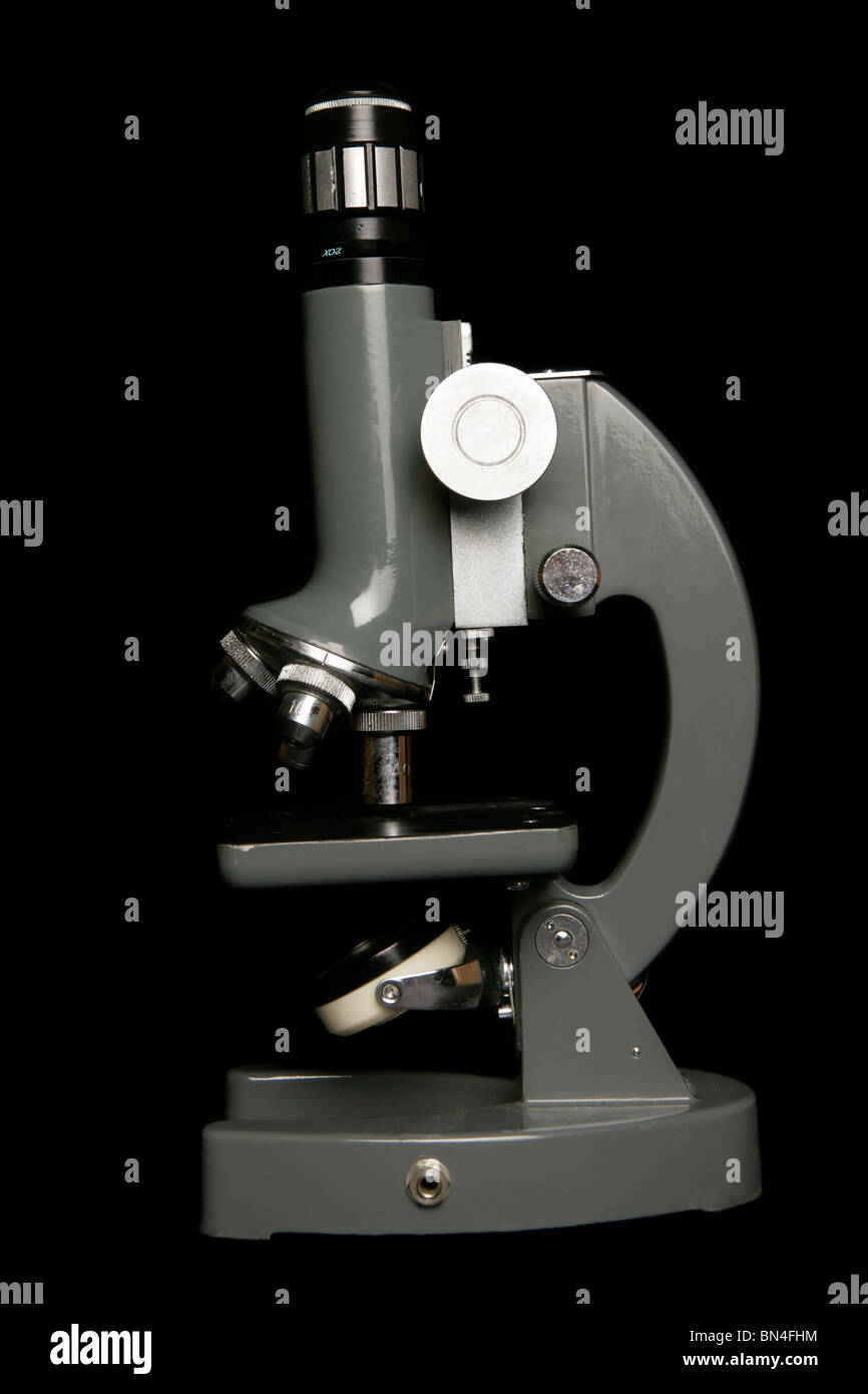 Microscope on black background in studio Stock Photo - Alamy