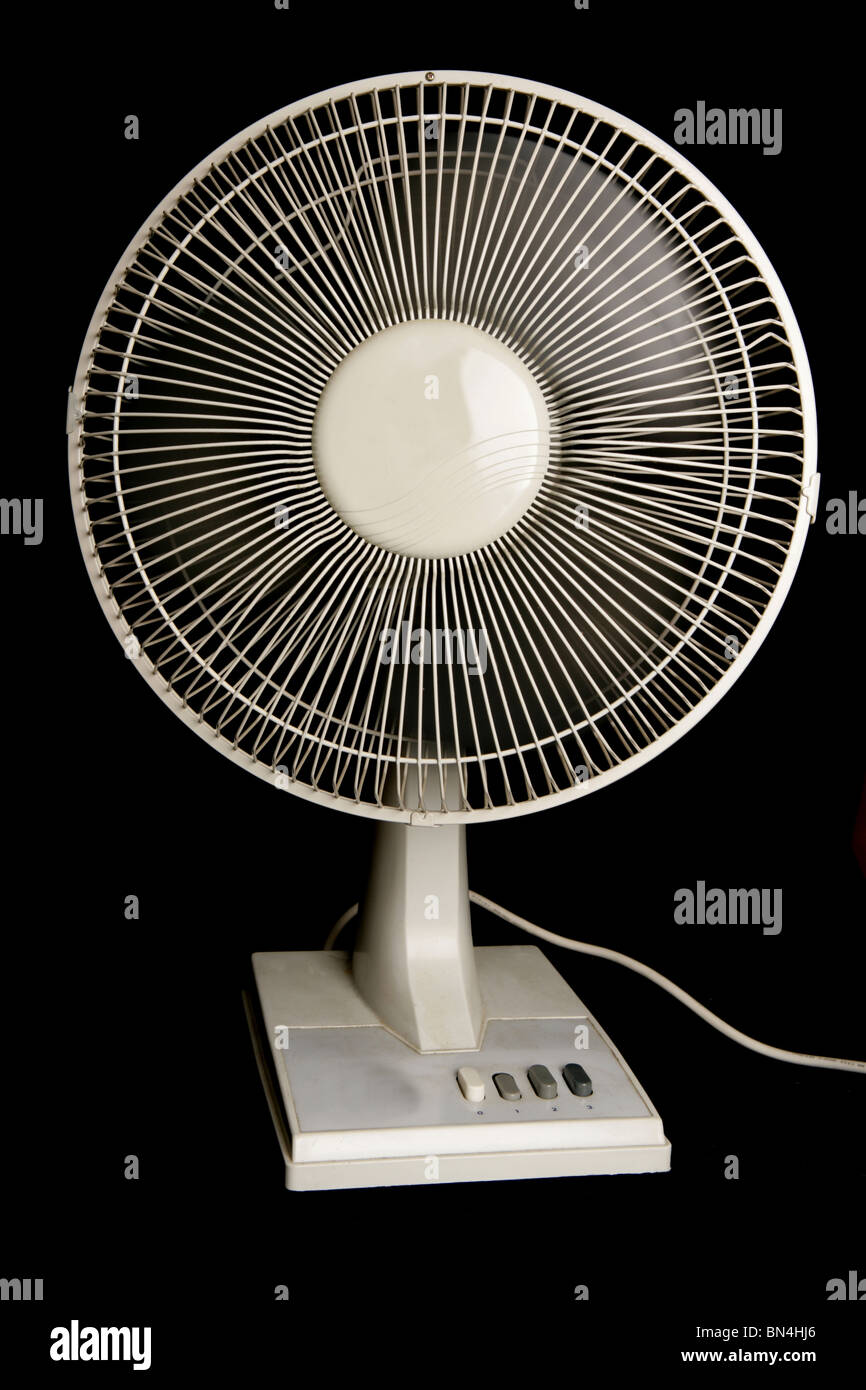 Fan on black background in studio Stock Photo - Alamy