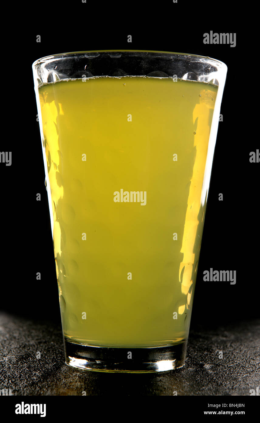 Orange squash in glass in studio Stock Photo - Alamy