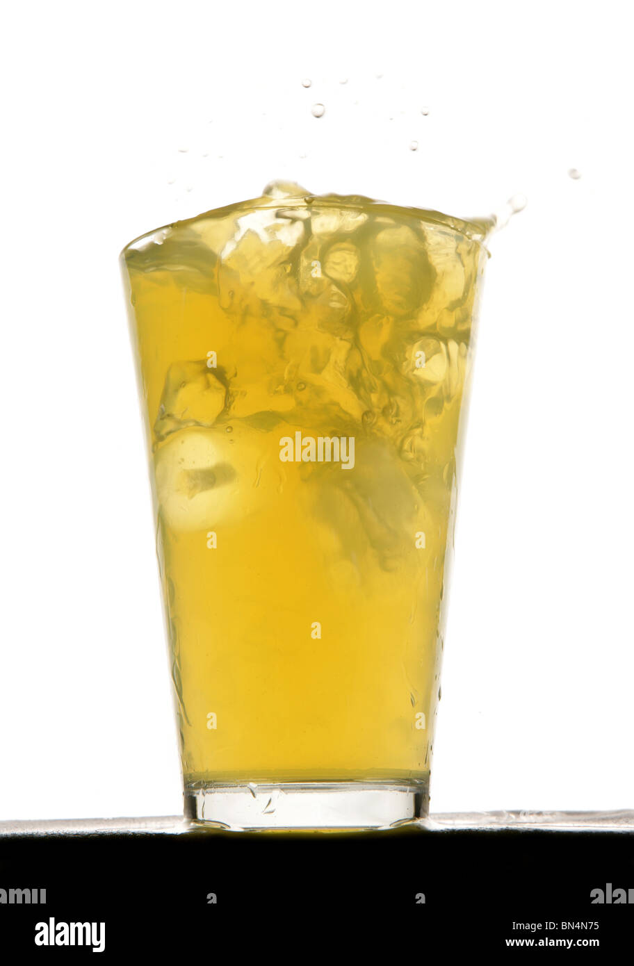 Orange squash drink with ice in studio Stock Photo - Alamy