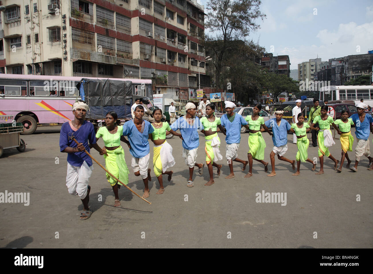 Warli tribal dance on road during the religious procession of goddess ...