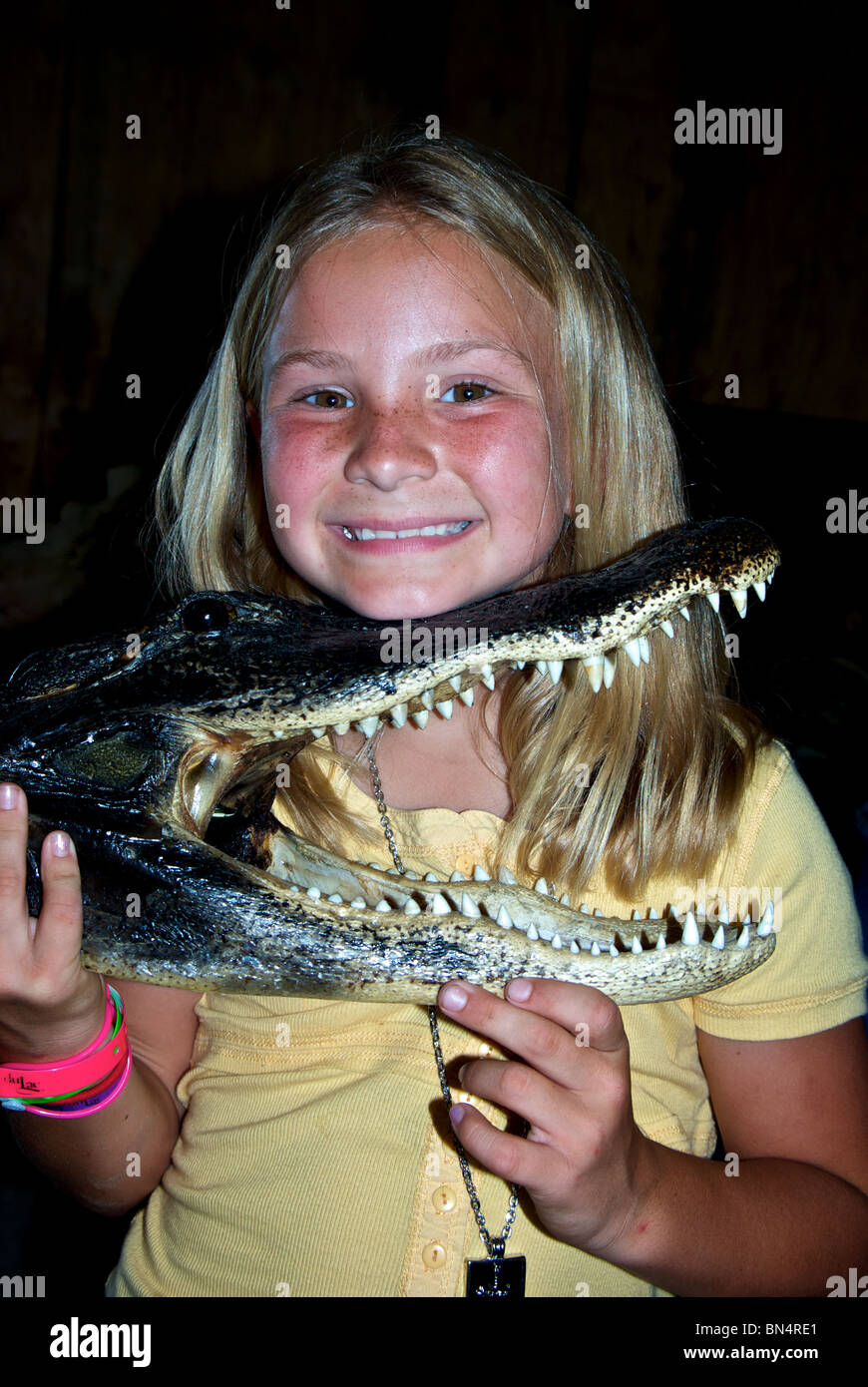 Young pretty smiling blond freckle faced Louisiana girl holding dried ...