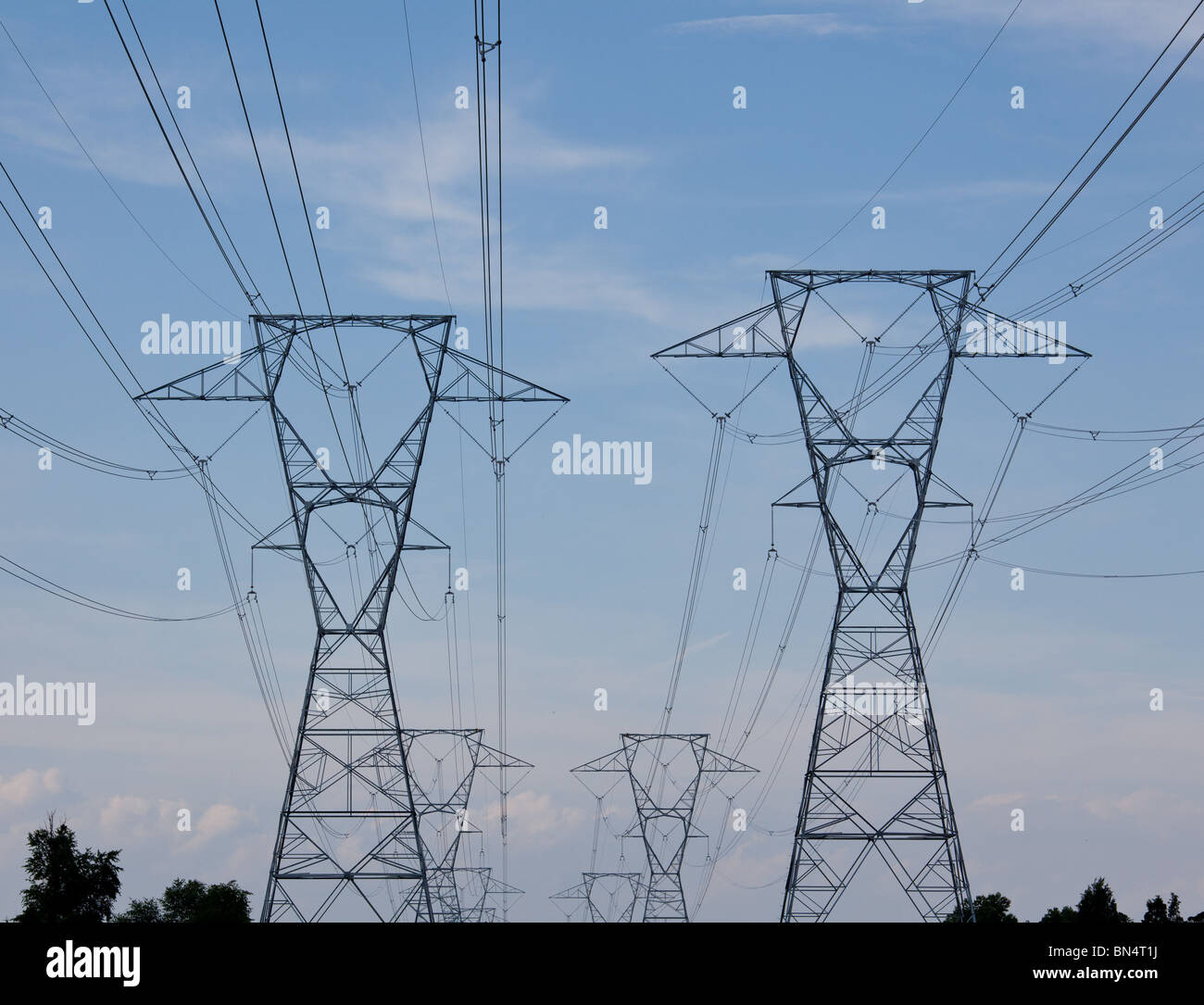 Large electricity pylons march across the countryside, France Stock ...