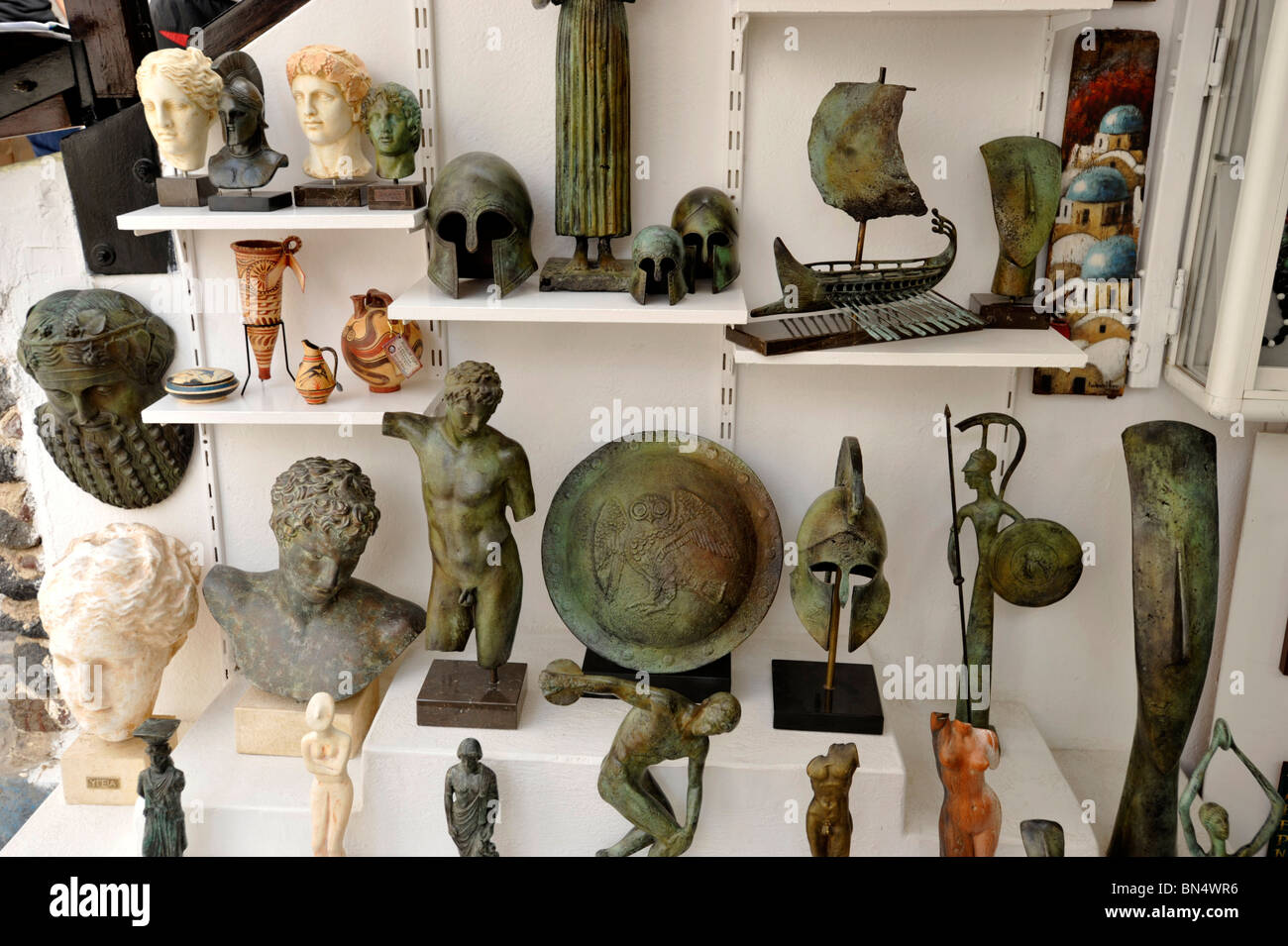 A range of reproduction Bronze artifacts in a tourist shop in Fira the ...