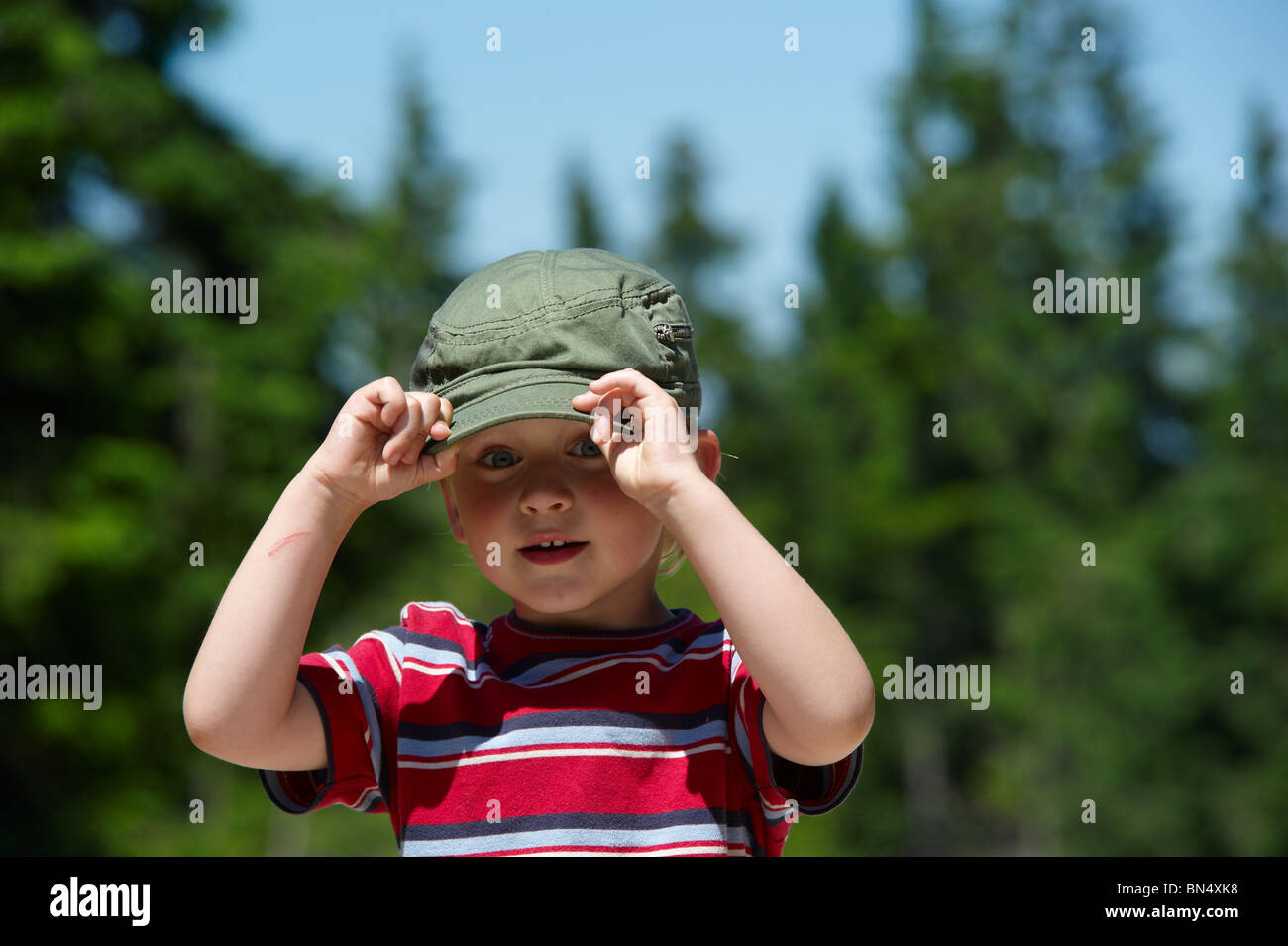 A boy playing in the forest summer Stock Photo - Alamy