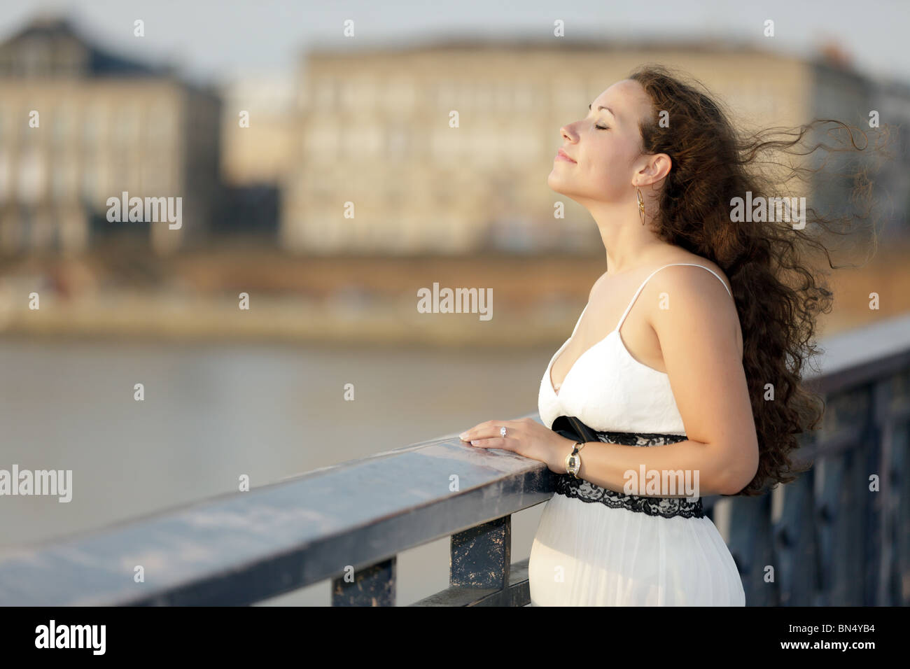 beautiful woman breathing air on bridge, bordeaux, france Stock Photo ...