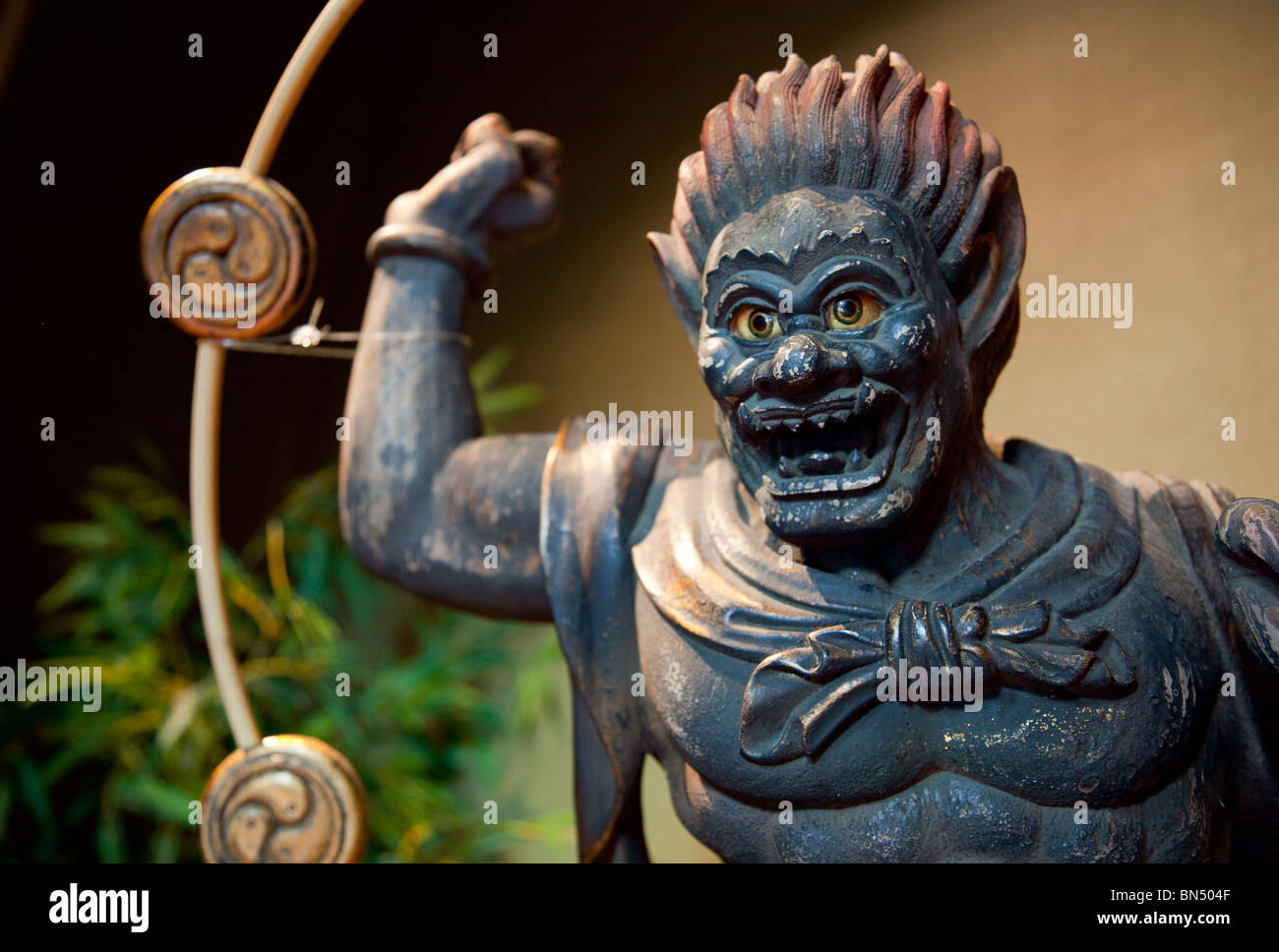 A Buddhist demon statue in the Temple of the Buddha's Tooth in ...