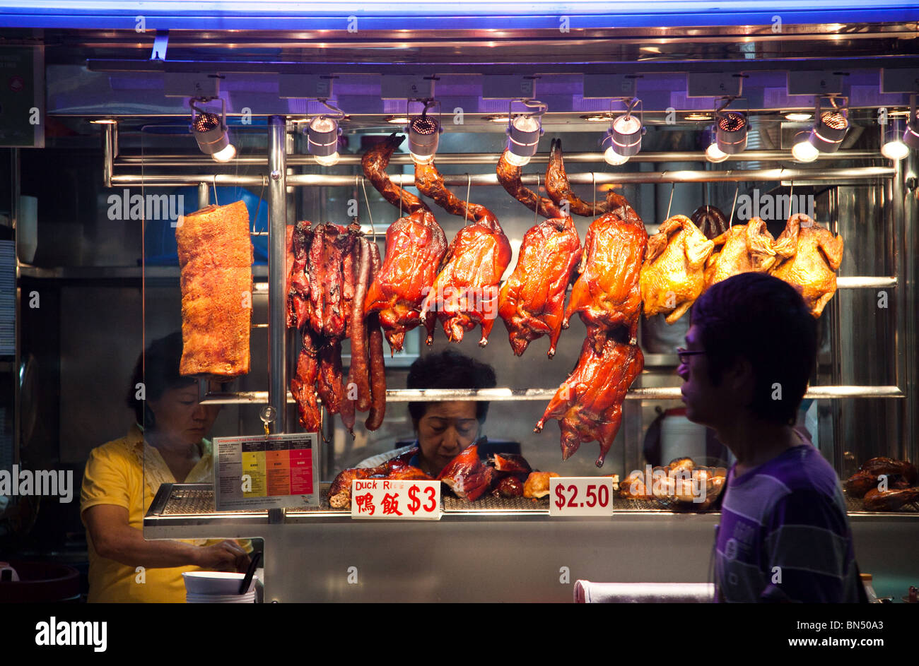 BBQ Duck and Chicken hang from a Chicken Rice stand in the Bedok Hawker ...
